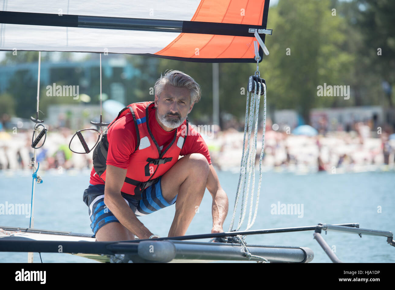 professional waterman training on lake with catamaran Stock Photo - Alamy