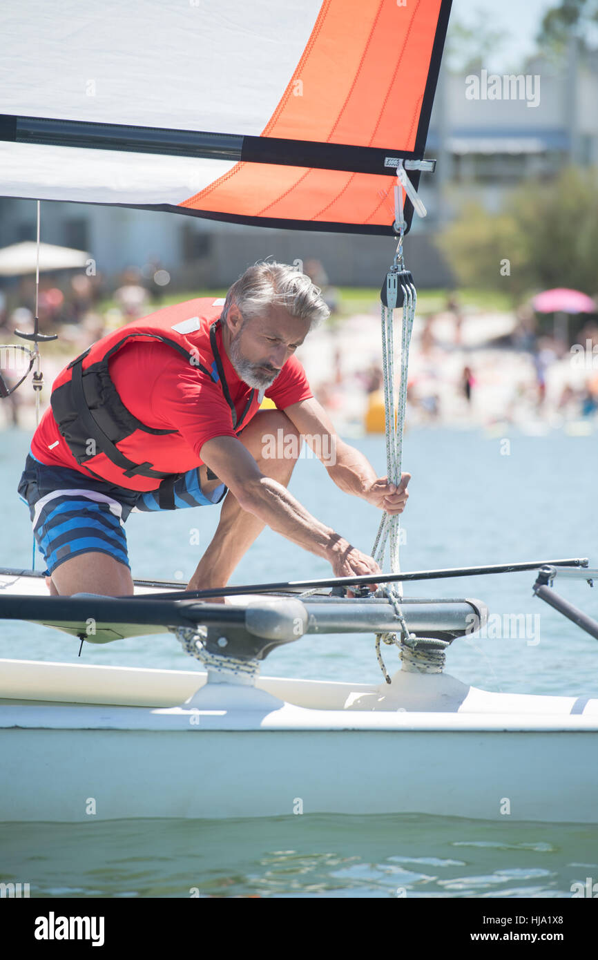 professional waterman training on lake with catamaran Stock Photo - Alamy
