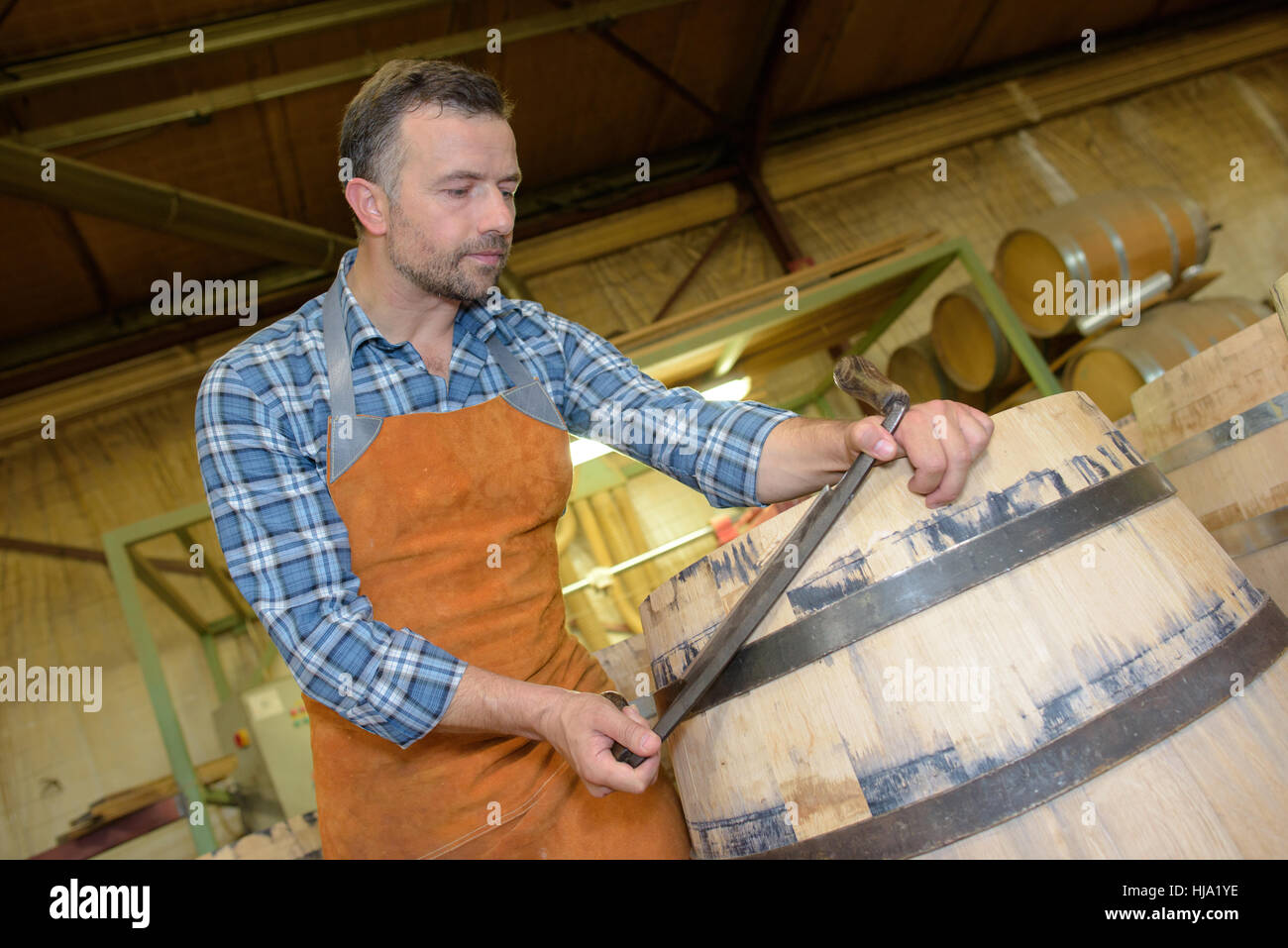 Cooper working on barrel Stock Photo - Alamy