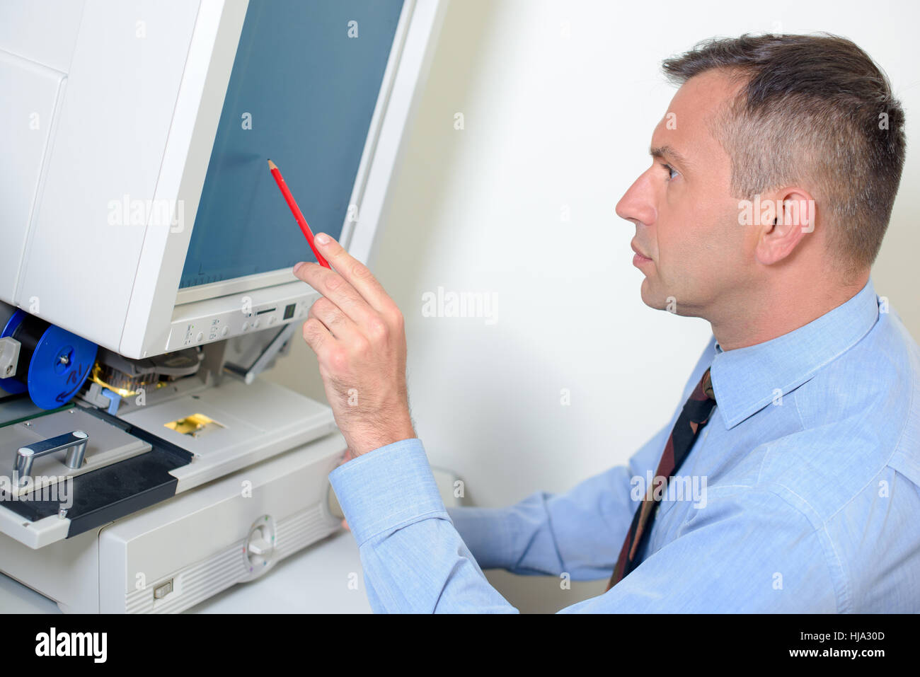 Smart man using computer Stock Photo - Alamy