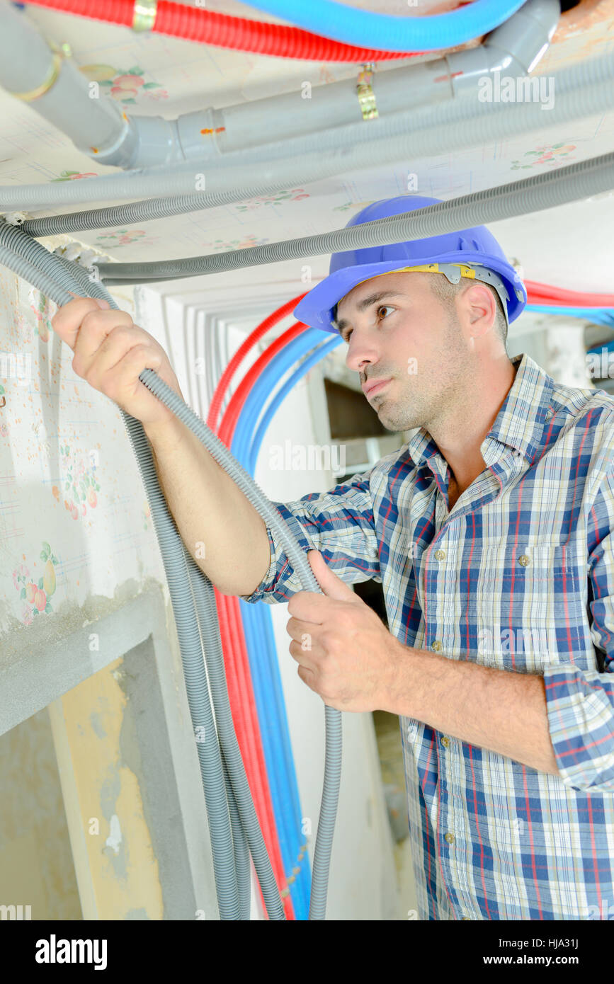 man running cables Stock Photo - Alamy