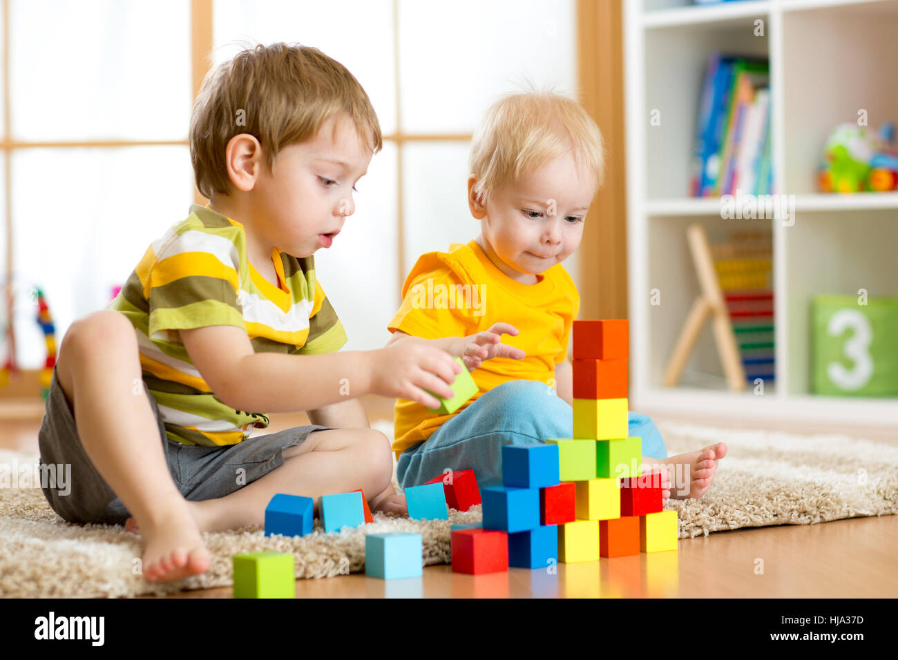 Children playing inside room hi-res stock photography and images - Alamy