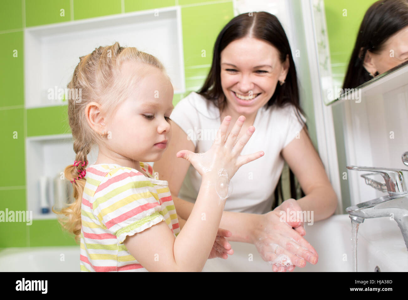 Child washing hands bathroom hi-res stock photography and images - Alamy