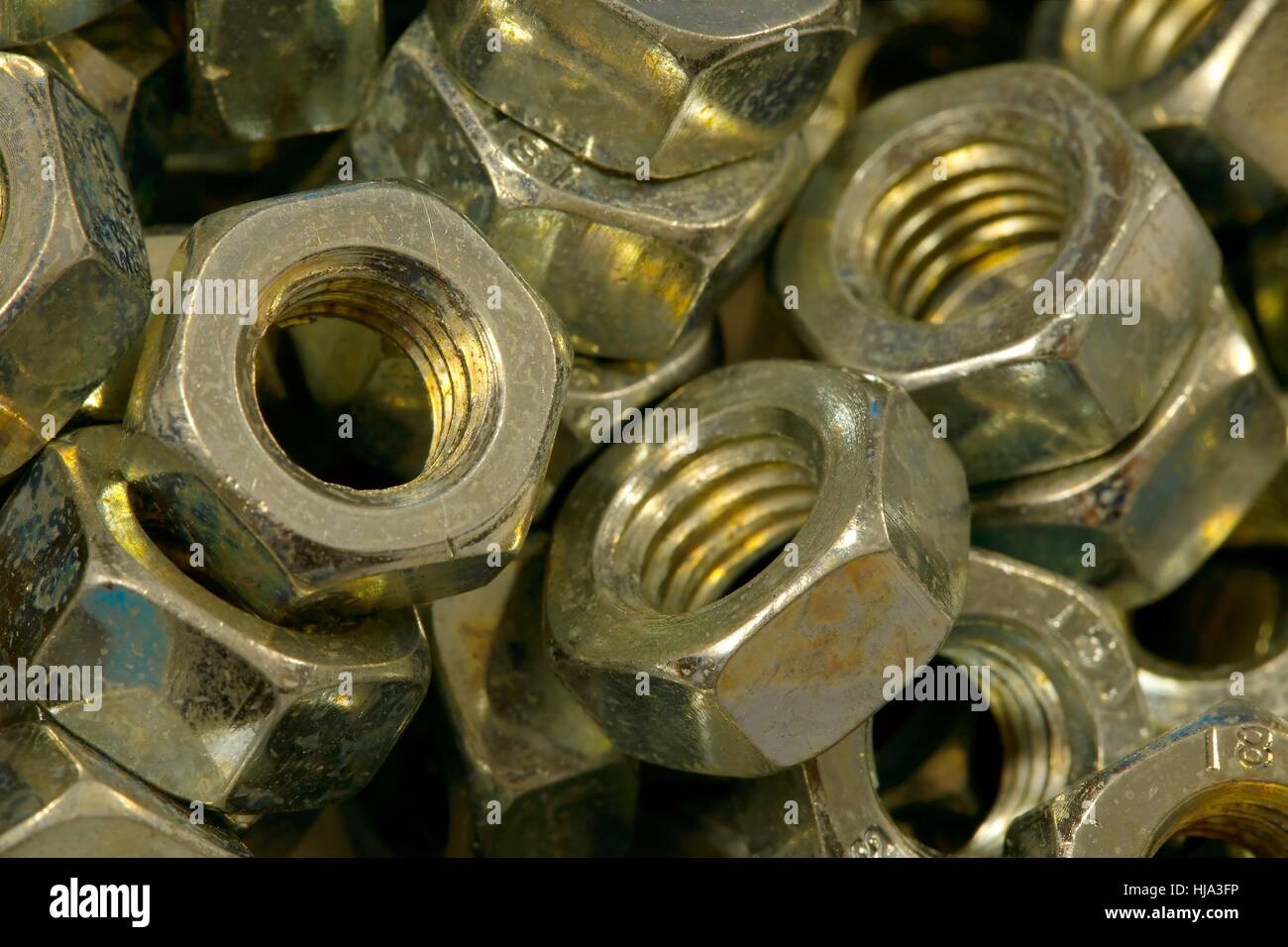 A pile of metal nuts Stock Photo - Alamy