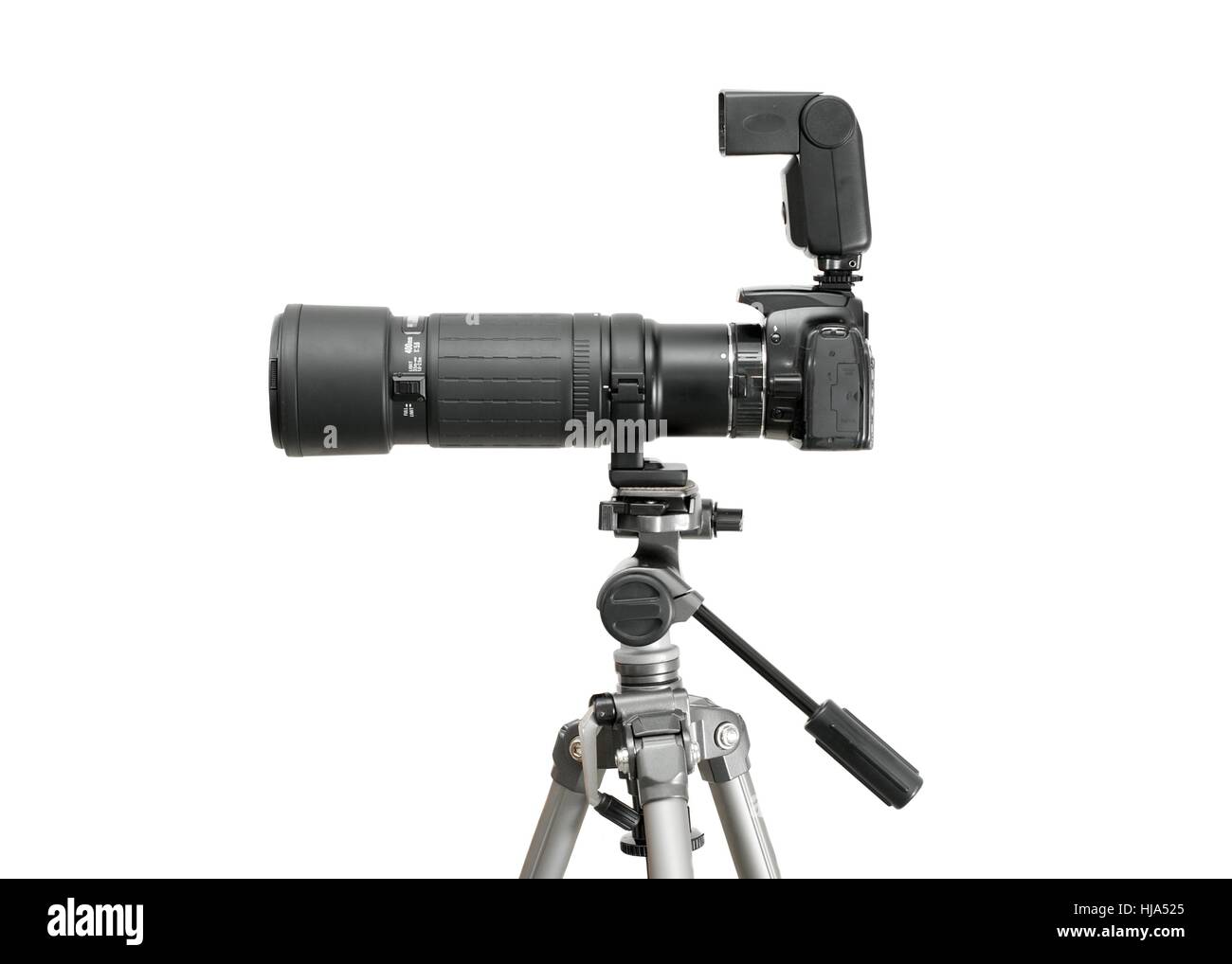 Camera on a tripod with telephoto lens Stock Photo - Alamy