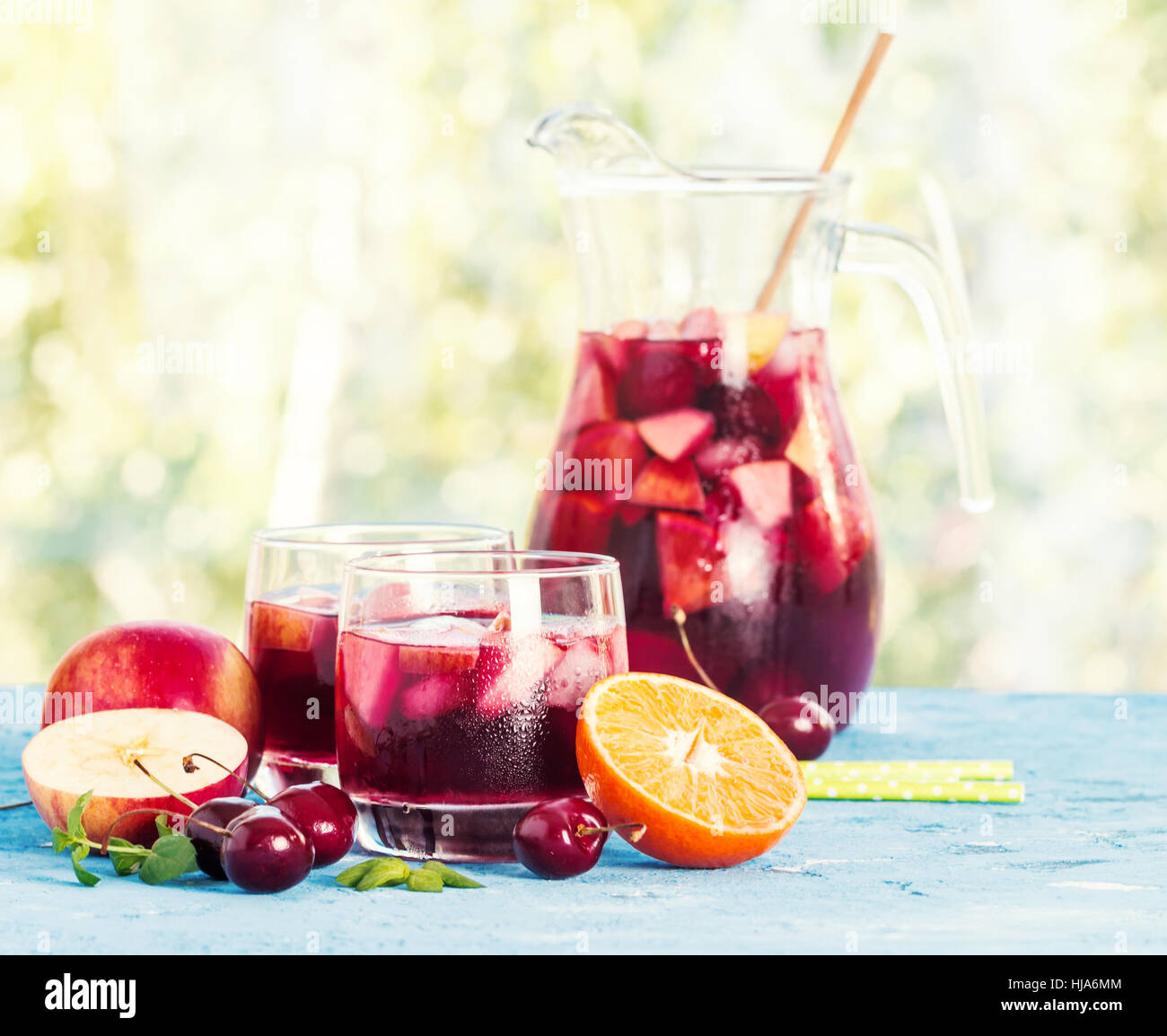 Refreshing sangria or punch with fruits in glasses and pincher Stock ...