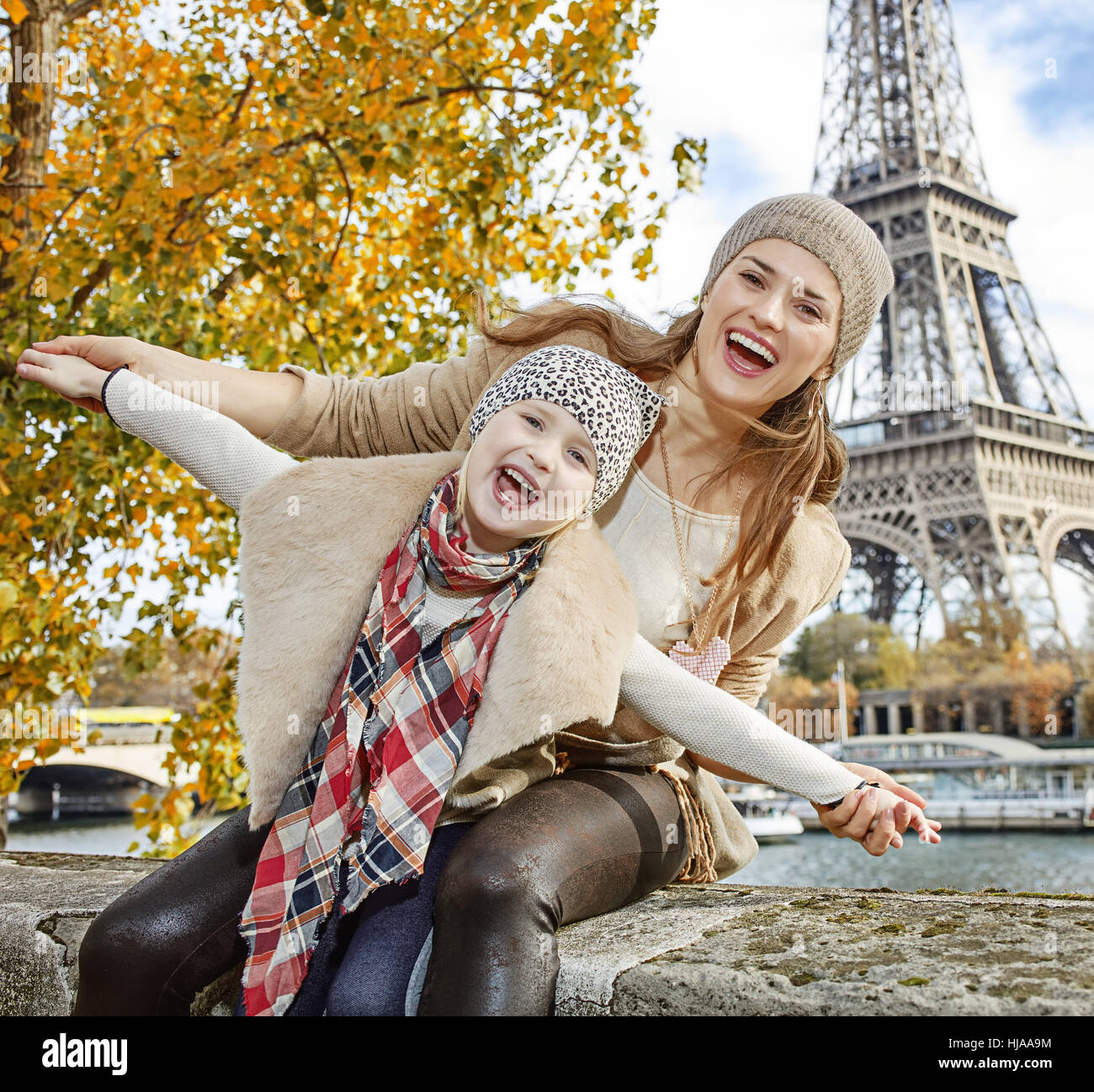 Autumn getaways in Paris with family. Portrait of smiling mother and ...