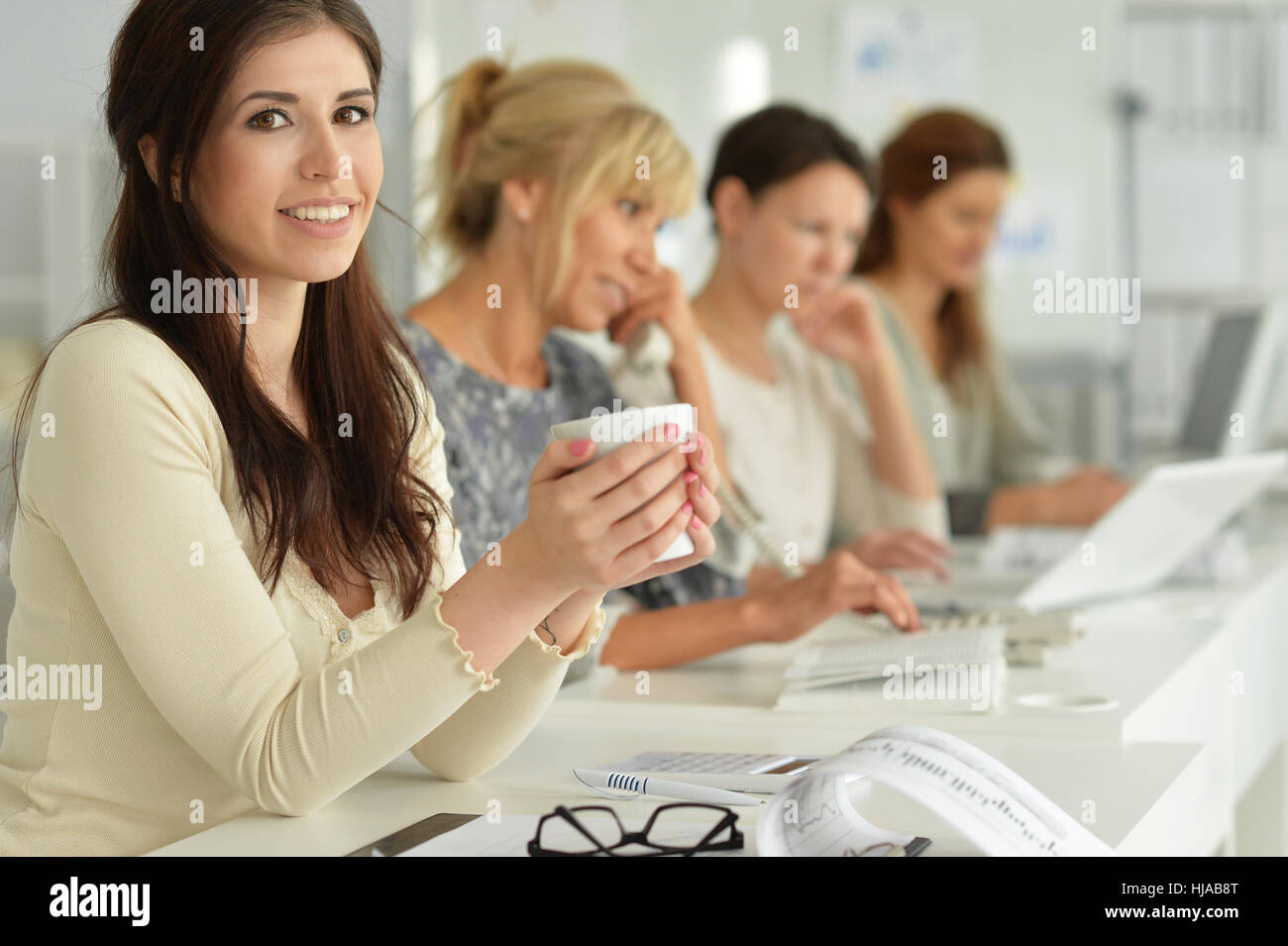 young women working at office Stock Photo - Alamy