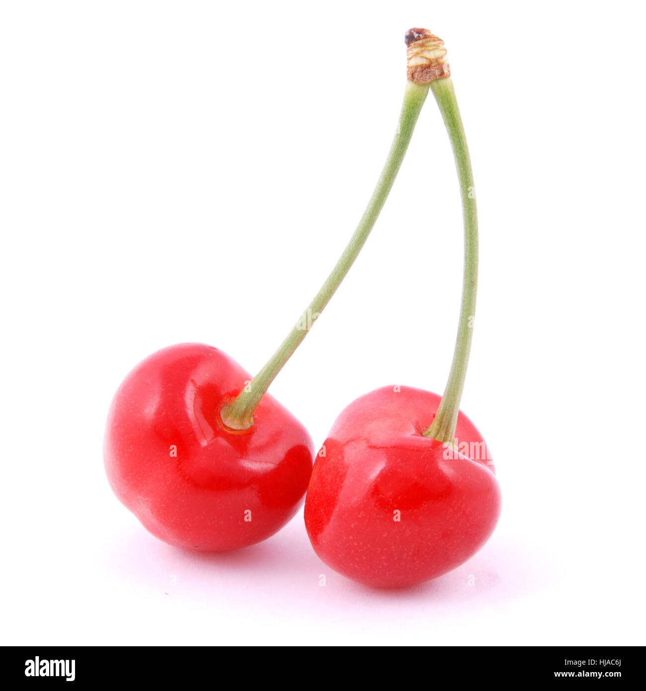 Red cherries on white background Cut Out Stock Images & Pictures - Alamy
