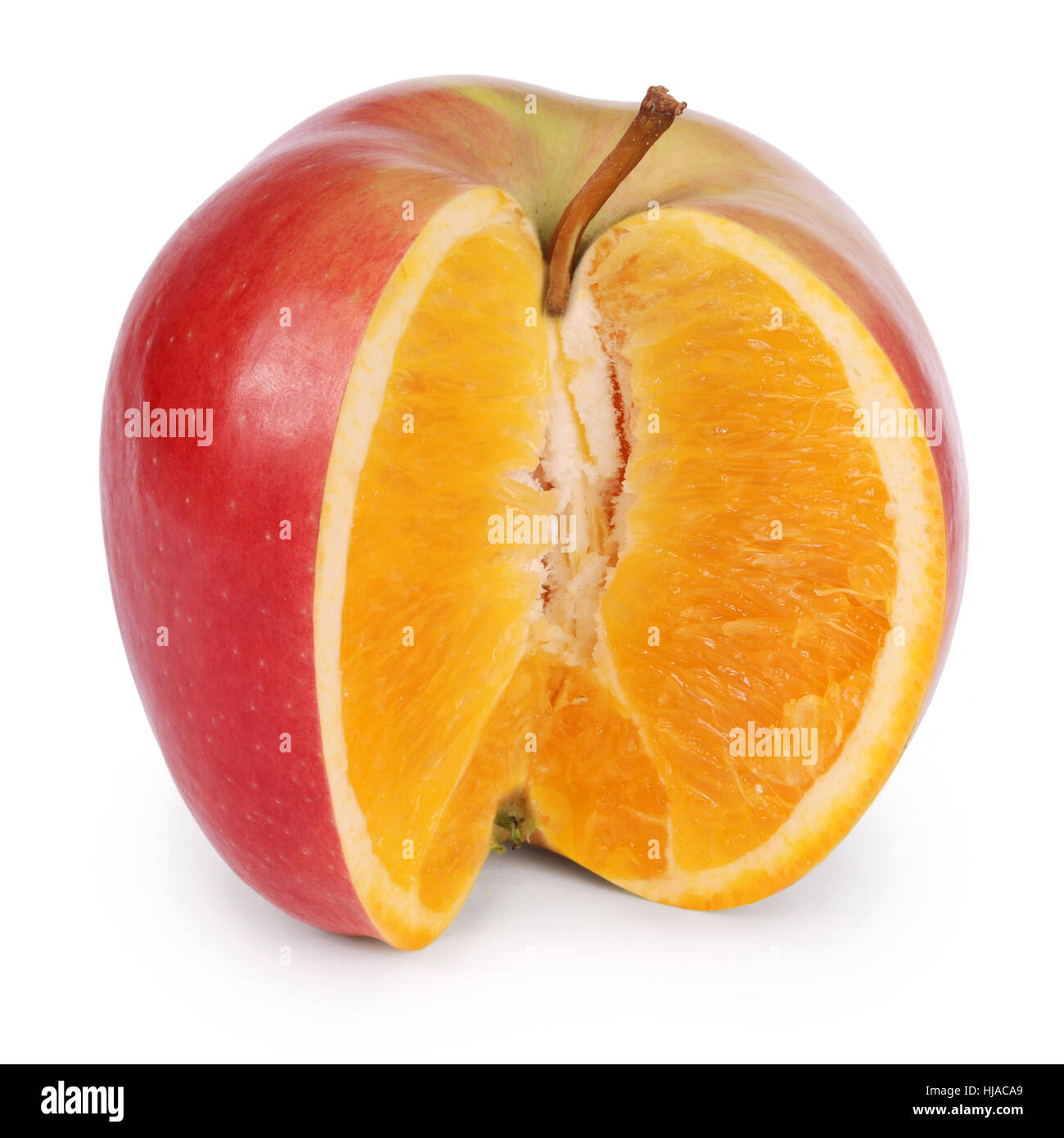 Apple and an orange combined into one piece of fruit on white. Clipping ...