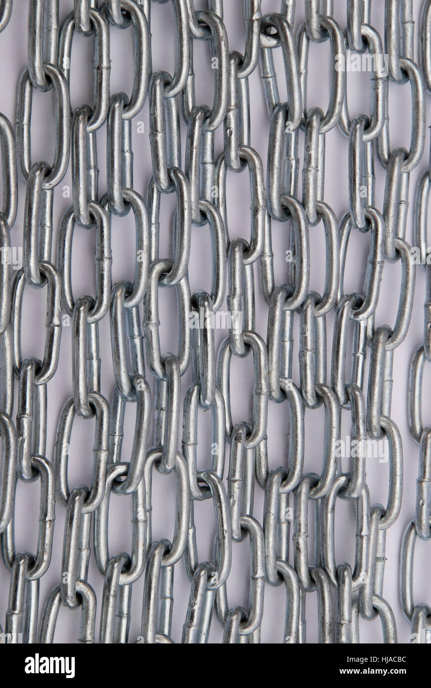 Metal chain folded in a row. natural shade Stock Photo - Alamy