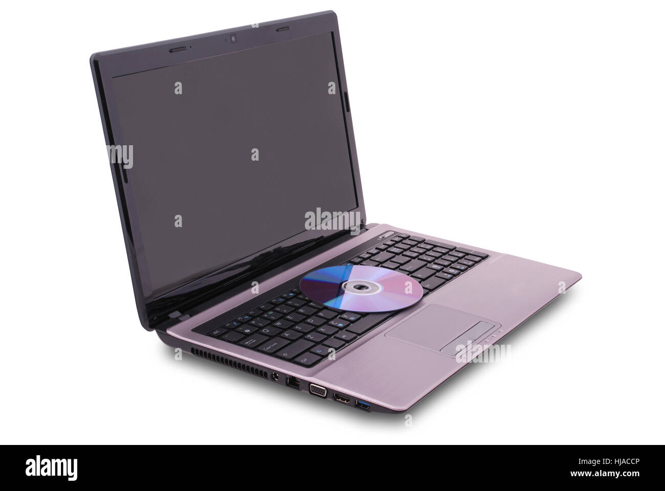 Laptop on white background. One CD are on the keyboard. Clipping path ...