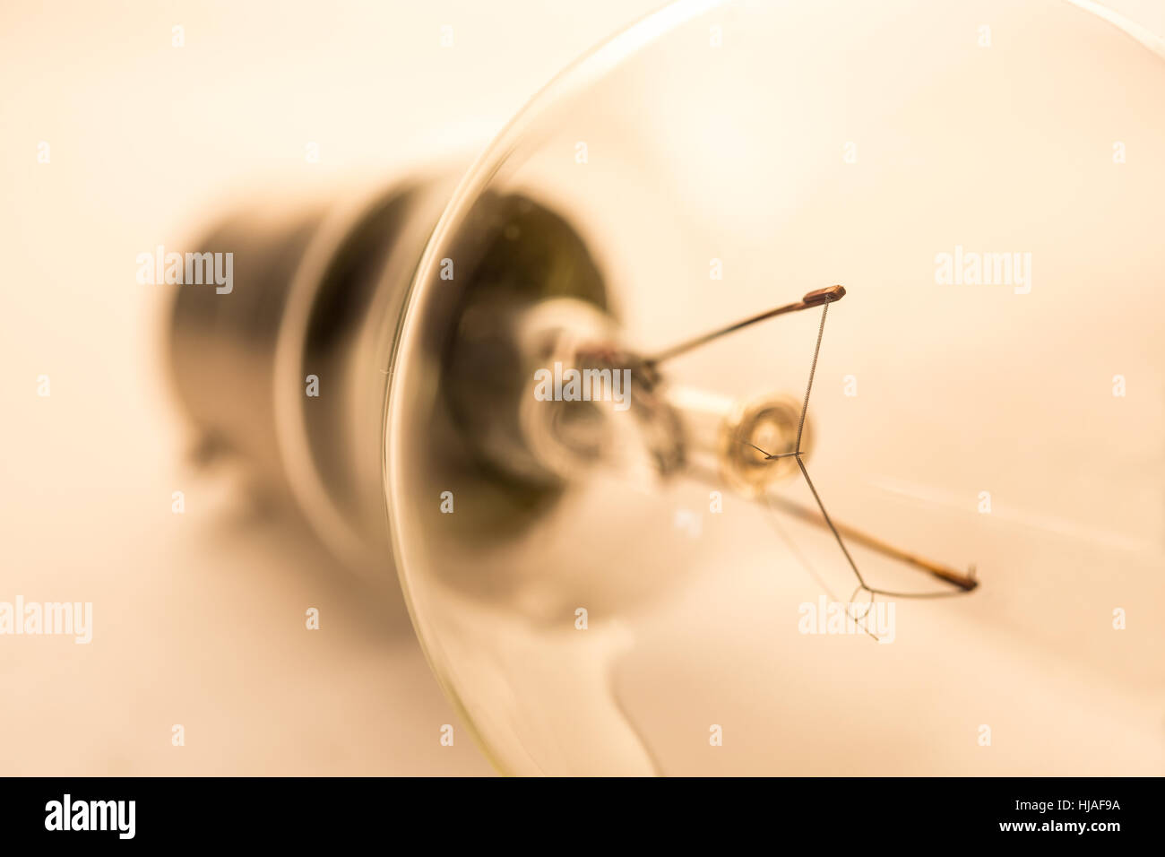 Clear light bulb on white surface laying on its side Stock Photo - Alamy