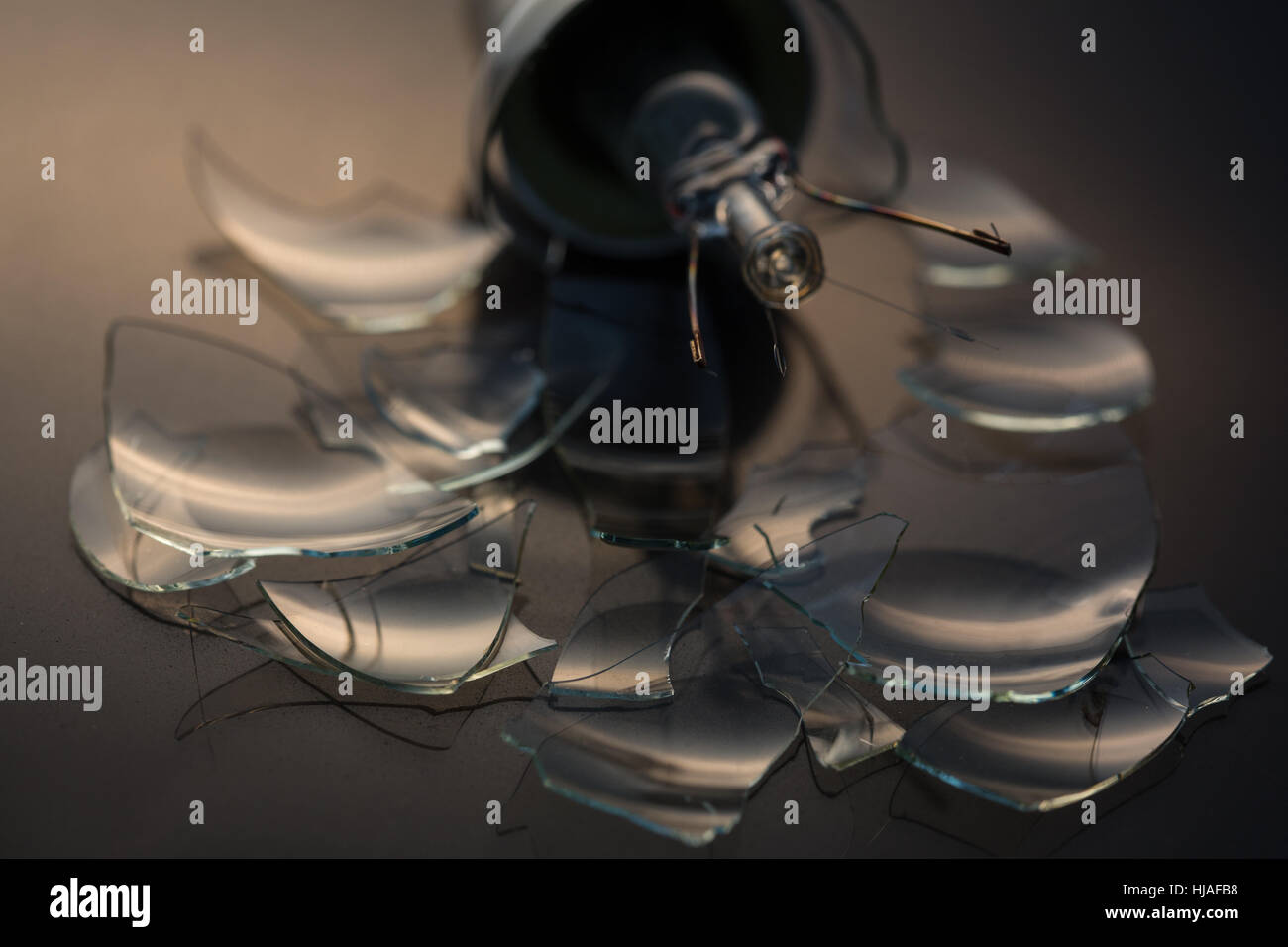Close up of broken light bulb glass in shards Stock Photo - Alamy