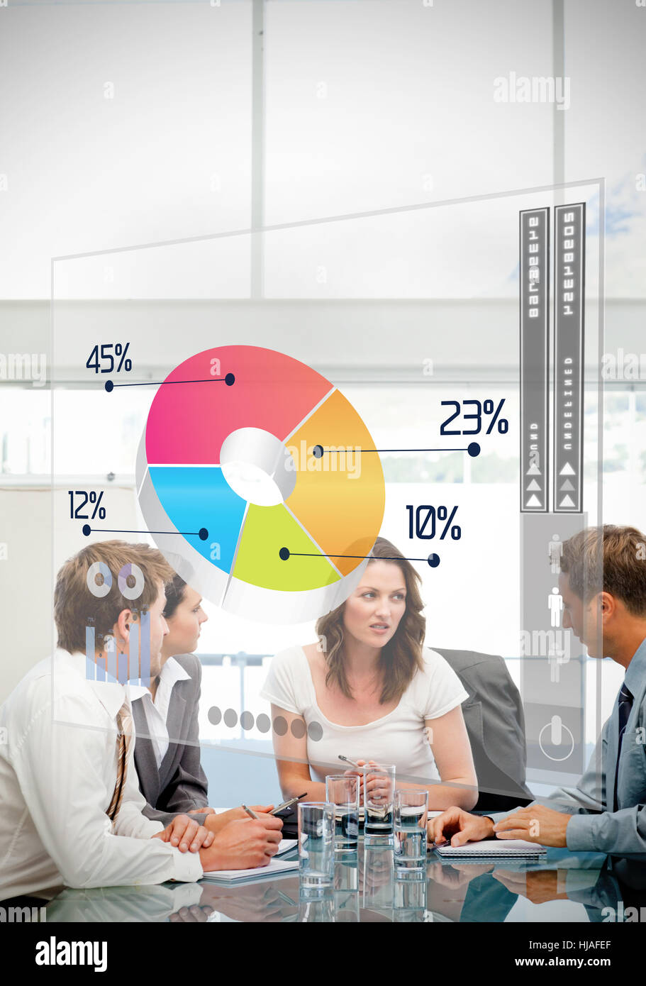 Business workers using colorful pie chart interface in a meeting Stock ...