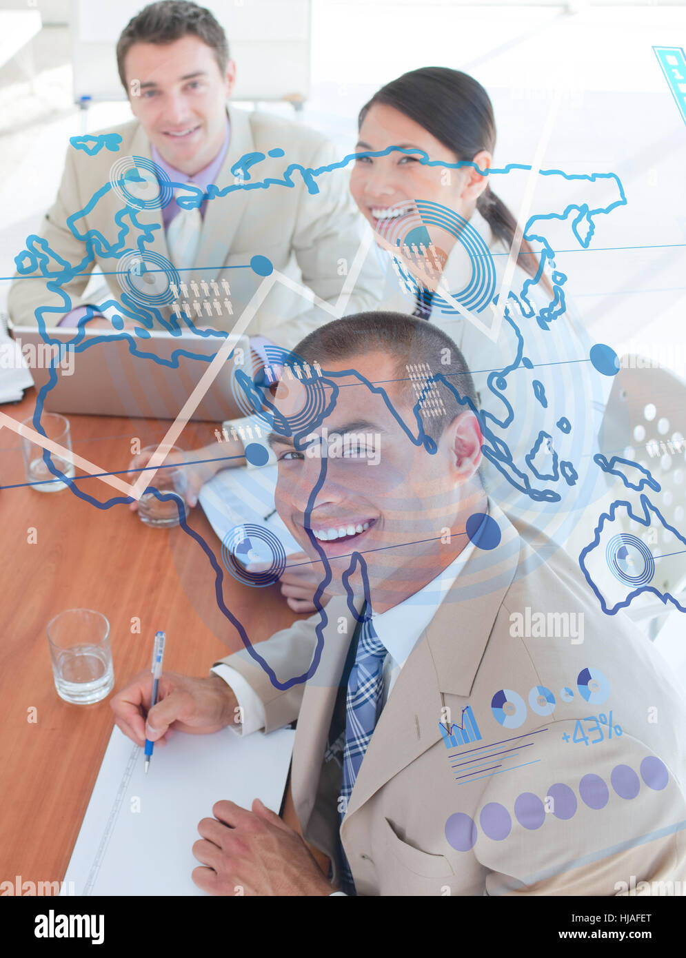 Overview of cheerful colleagues looking at blue map interface in a ...