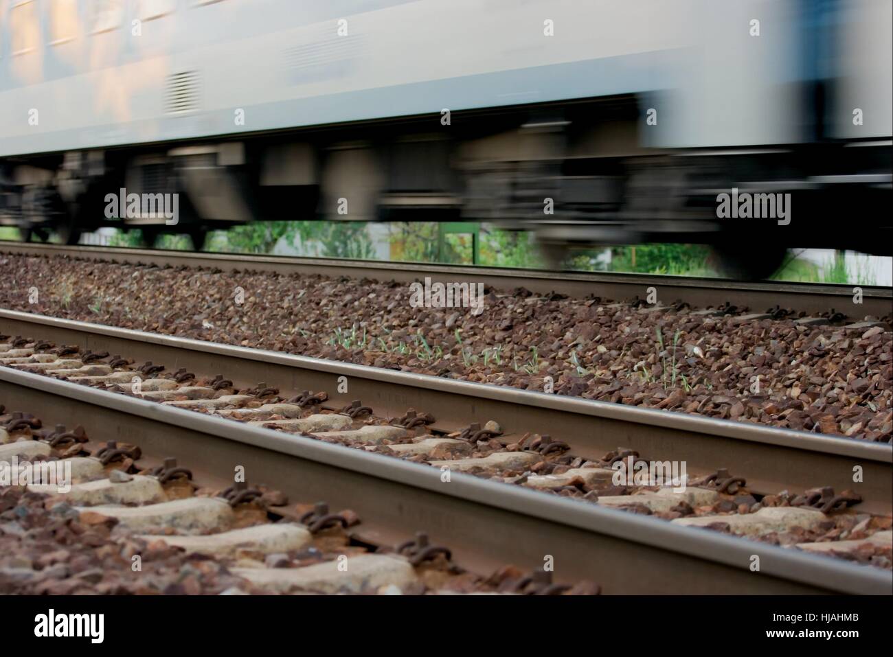 Passenger train on the track with motion blur Stock Photo - Alamy