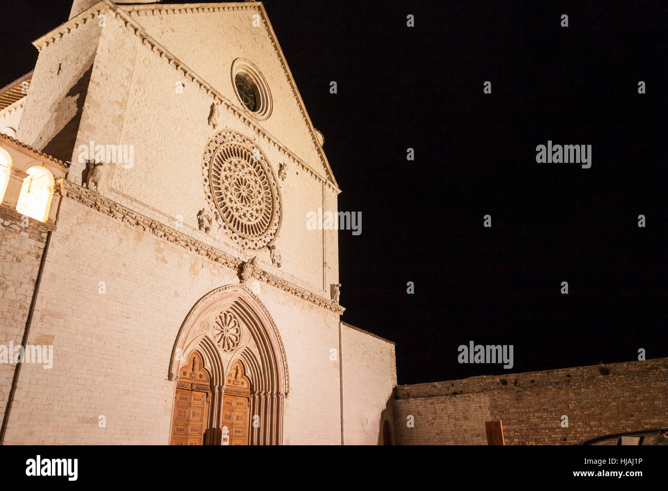 Facade of church at night illuminated. Assisi, Umbria. Italy Stock ...