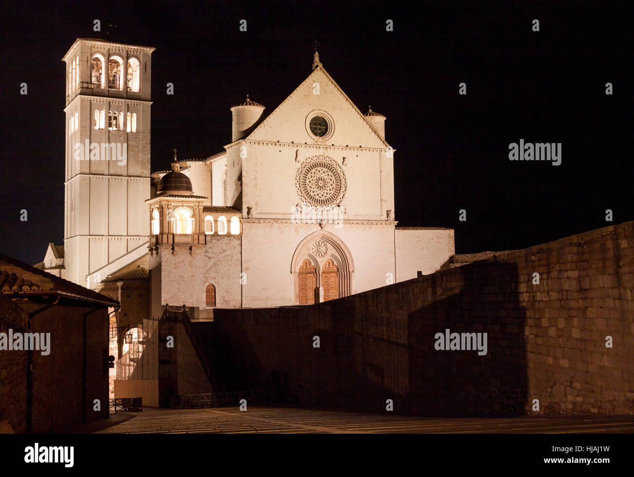 Facade of church at night illuminated. Assisi, Umbria. Italy Stock ...