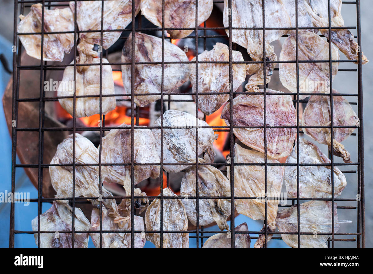 Grilled squid dried burn heat stove Stock Photo - Alamy
