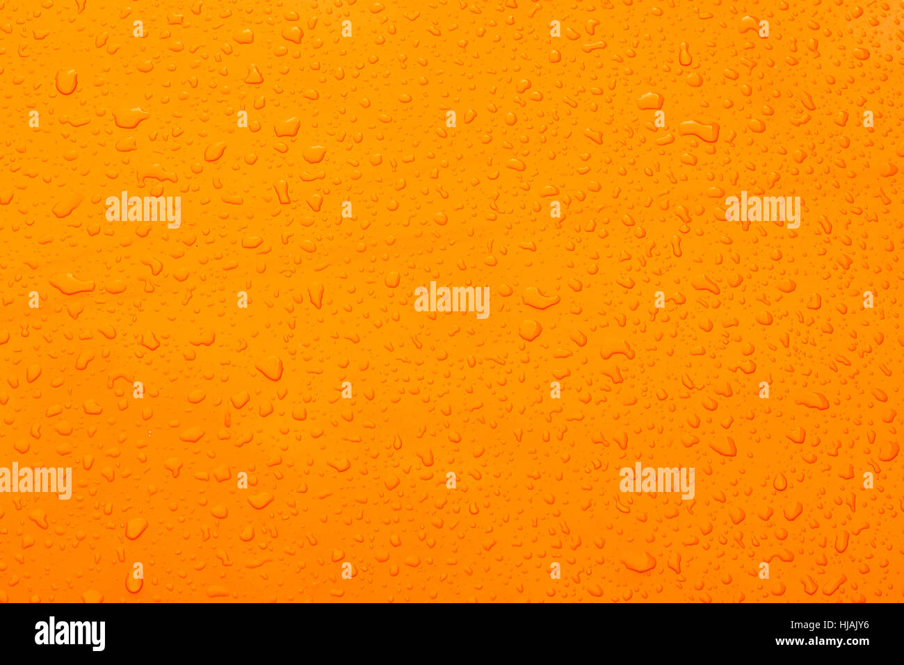 Water drop orange collor background Stock Photo - Alamy