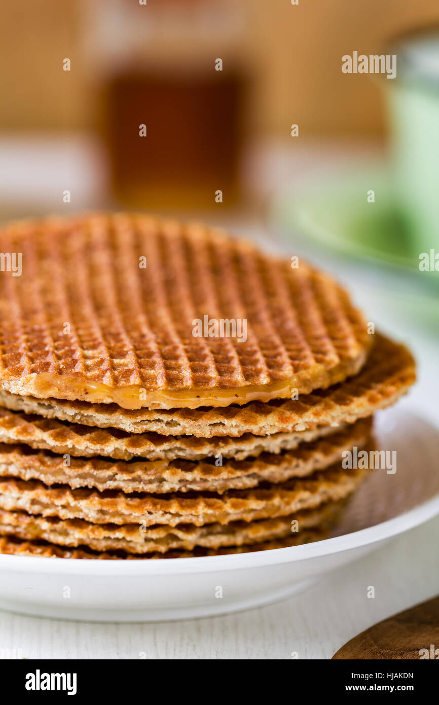 Pile of Stoopwafels by a cup of coffee Stock Photo - Alamy