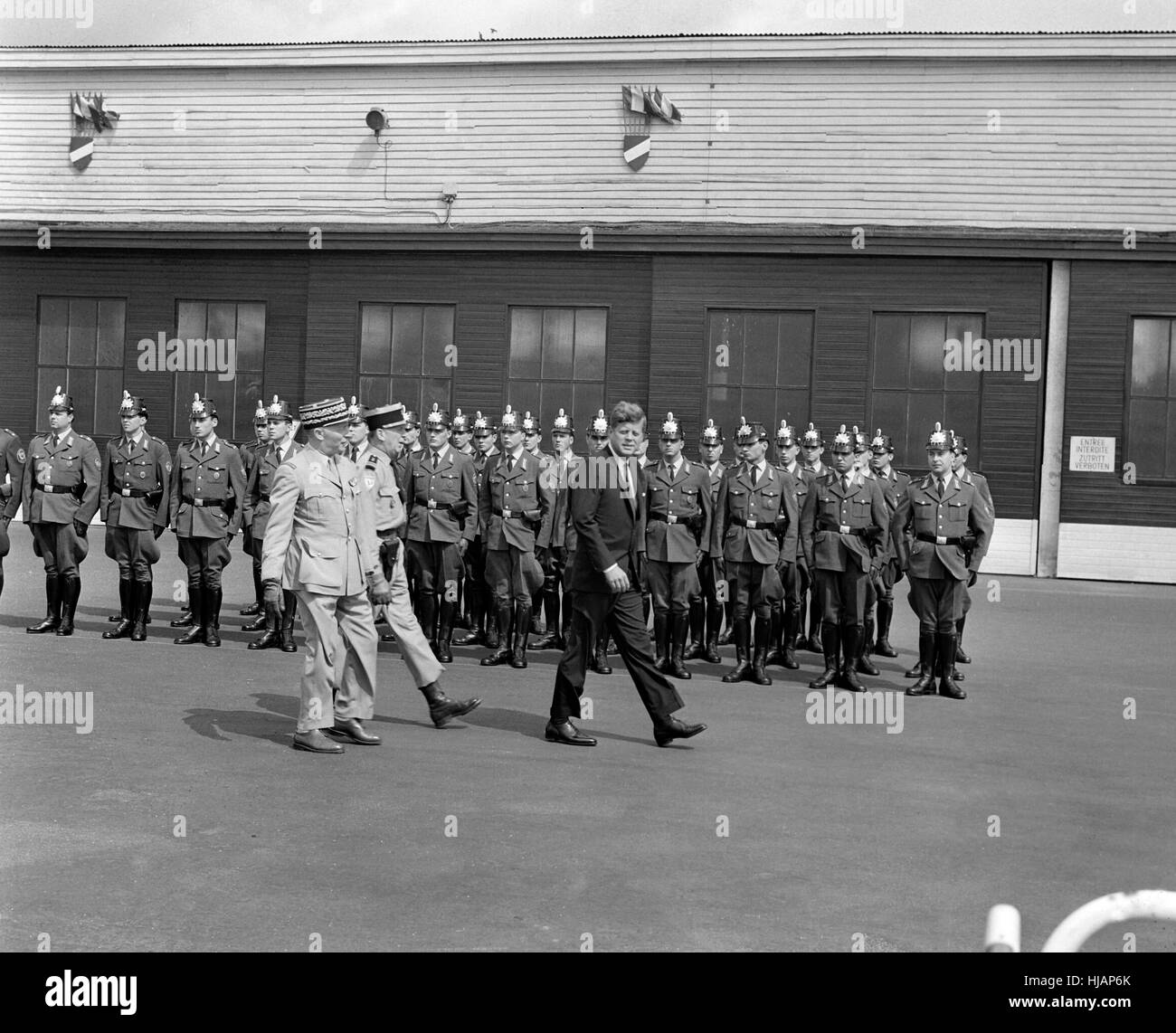 US president John F. Kennedy (M) after his arrival on the military ...