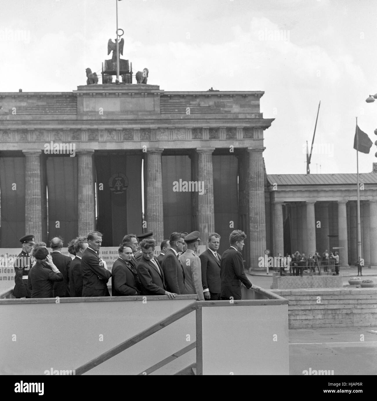 US president John F. Kennedy (r) at a view point at the Berlin wall ...