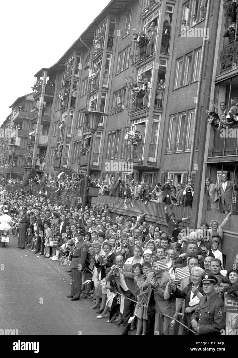 Cheering crowd at the roadside. After visiting a NATO military parade ...