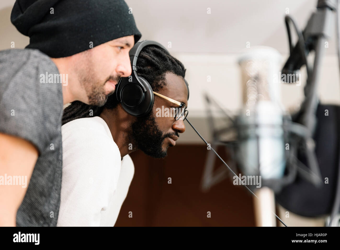 Artists producing music in their home sound studio Stock Photo - Alamy