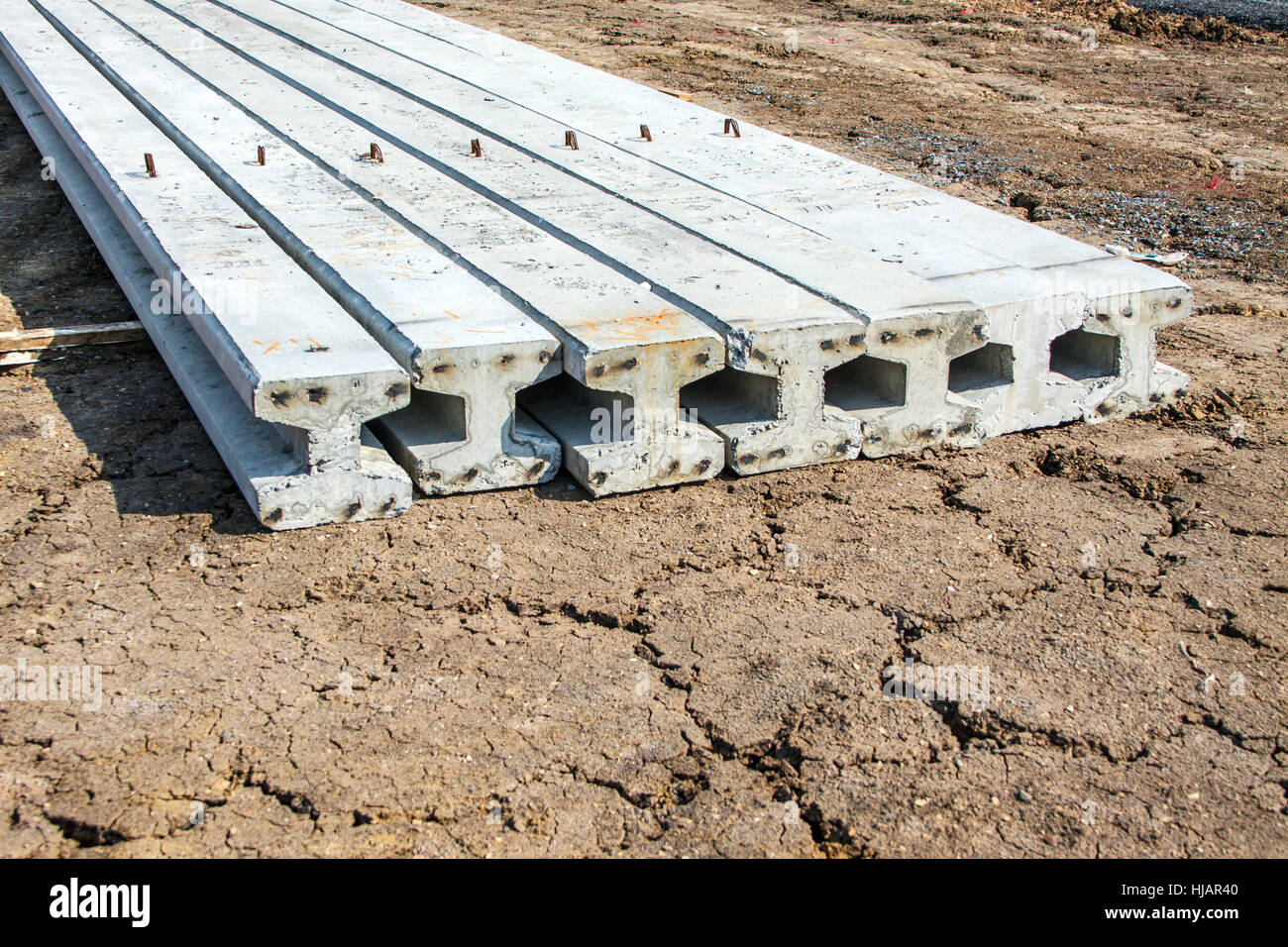 Concrete Stake at construction site with yellow truck in background ...