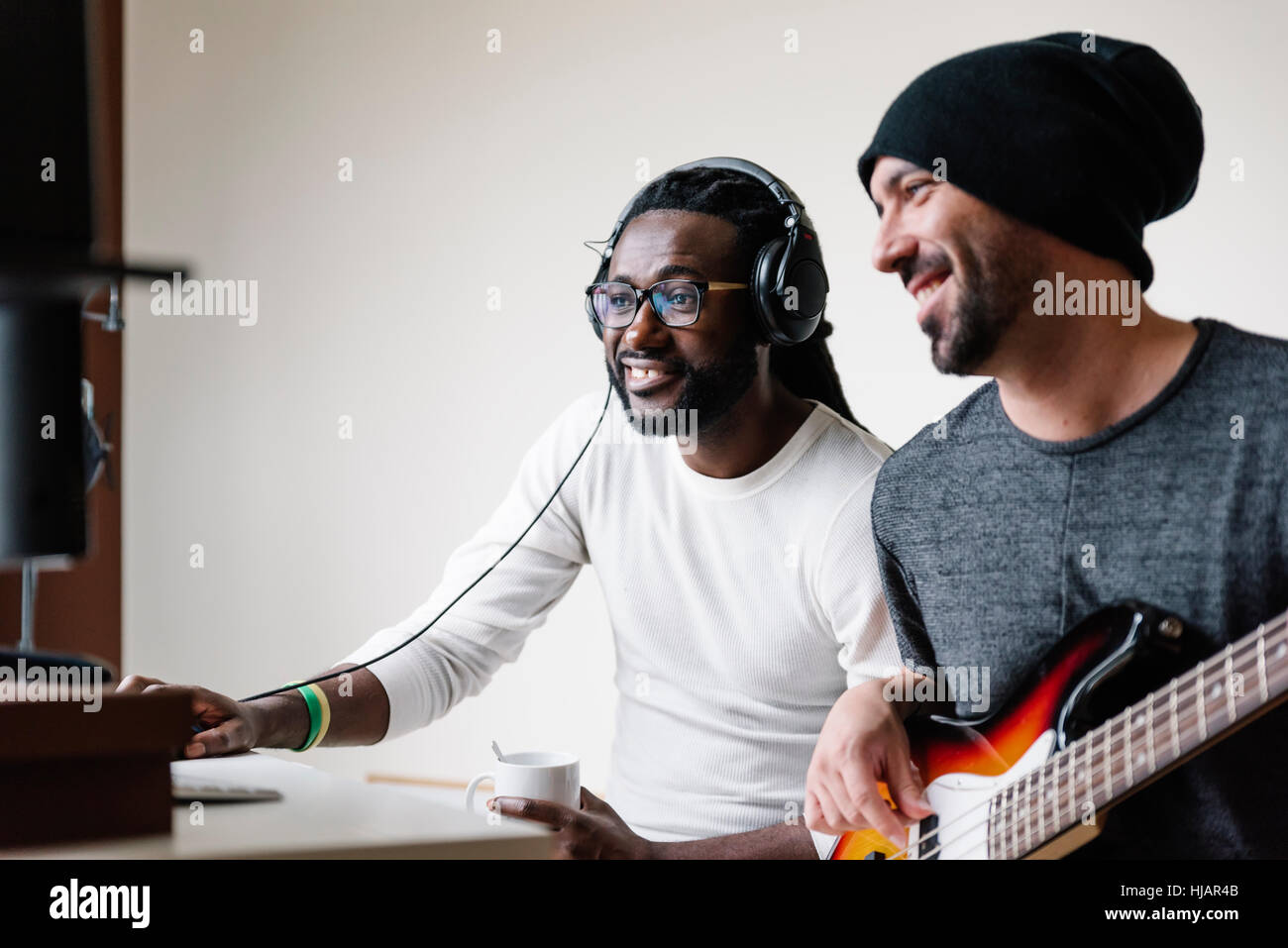 Artists producing music in their home sound studio Stock Photo - Alamy