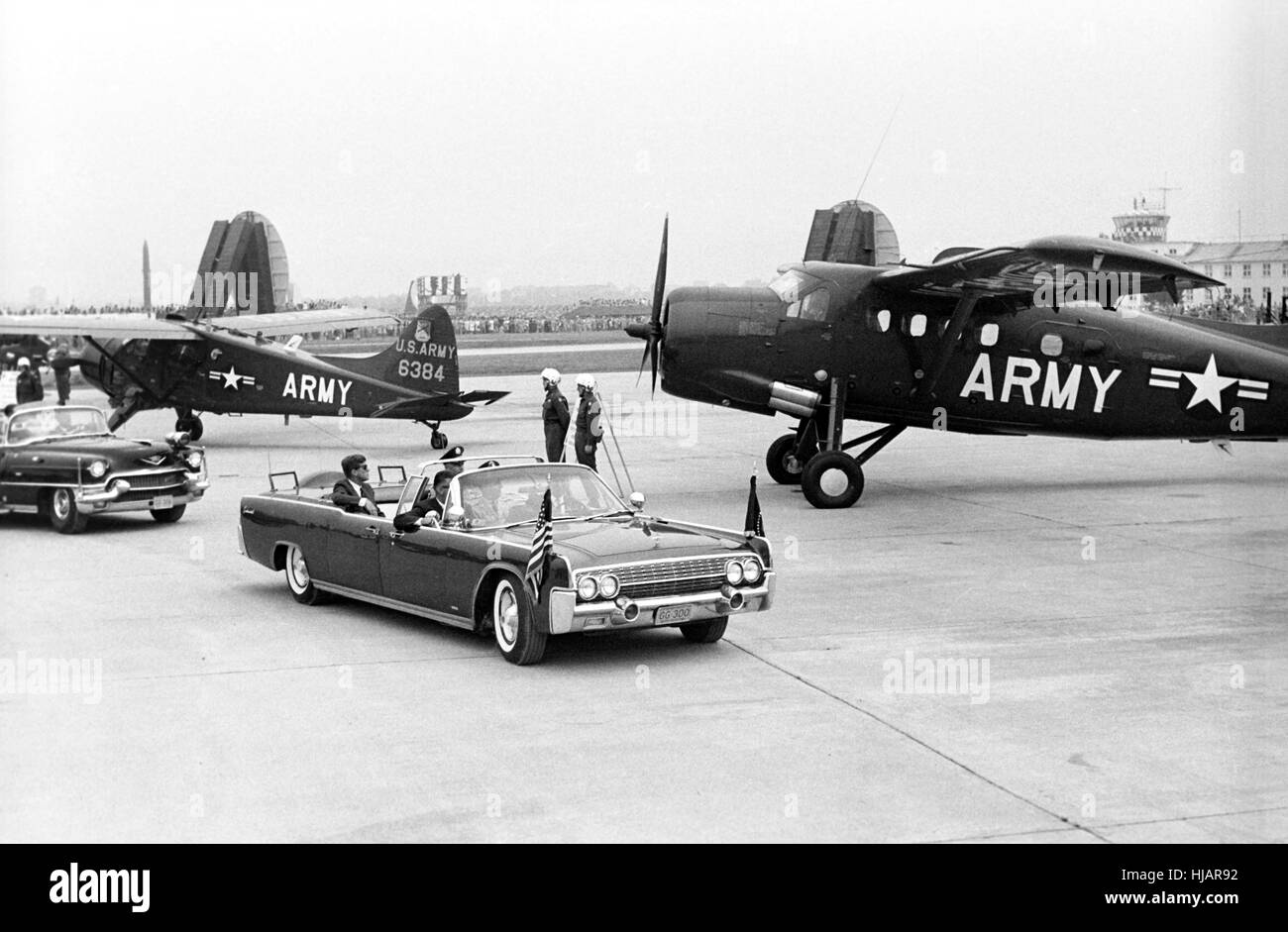 US president John F. Kennedy (l) at a military parade at US air base ...