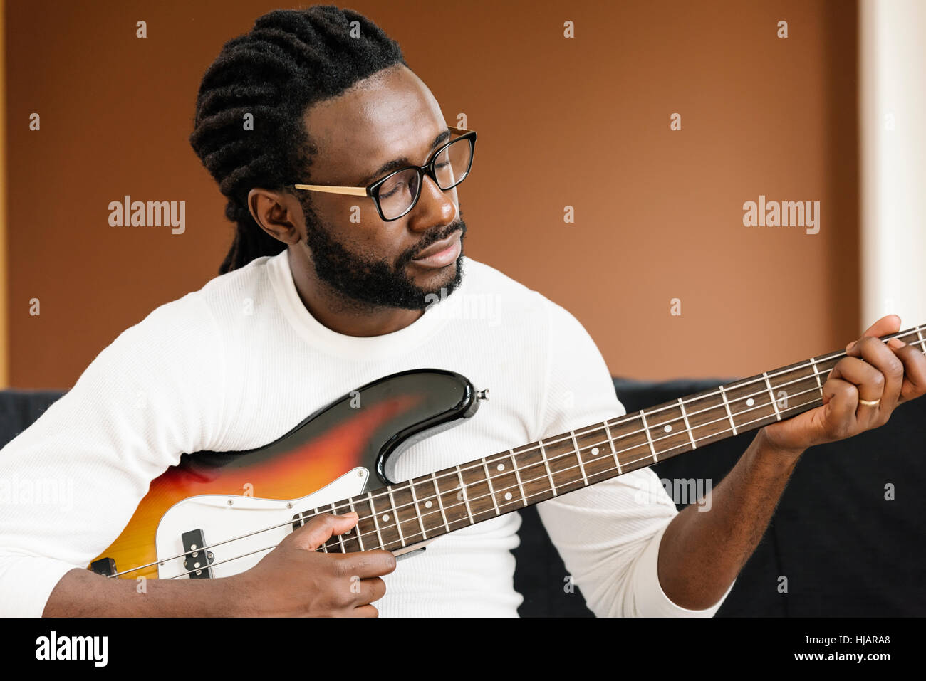 Artist producing music in his home sound studio Stock Photo - Alamy