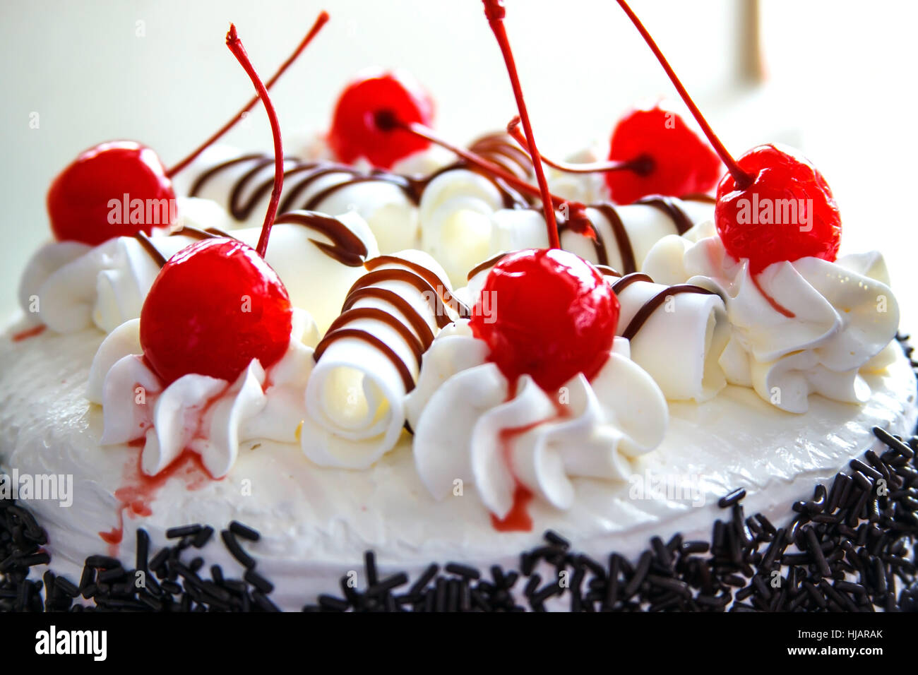 Cherry cake with white pipe chocolate Stock Photo - Alamy Cherry cake with white pipe chocolate Stock Photo - Alamy