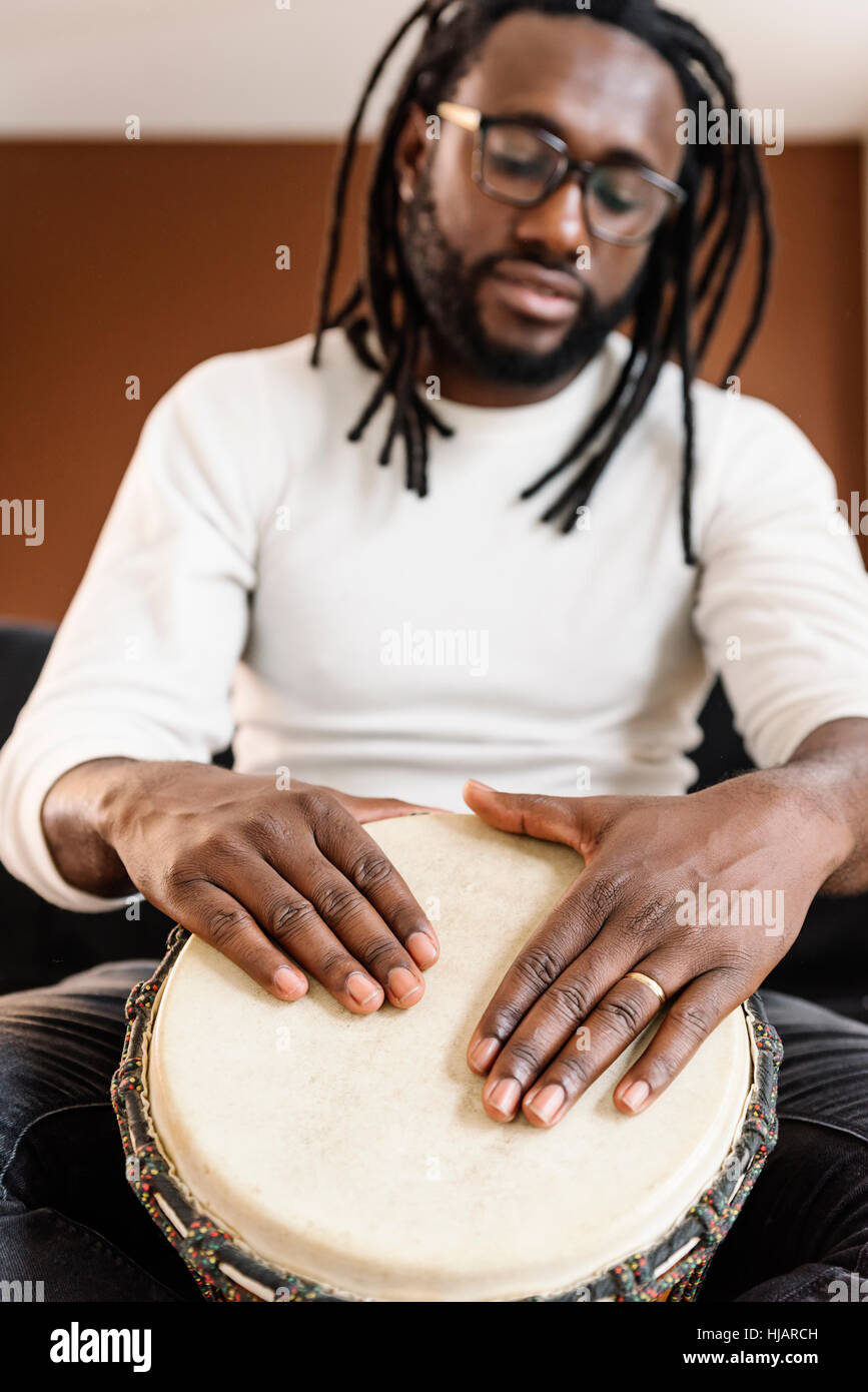 Musician Playing Drum with his hands Stock Photo - Alamy