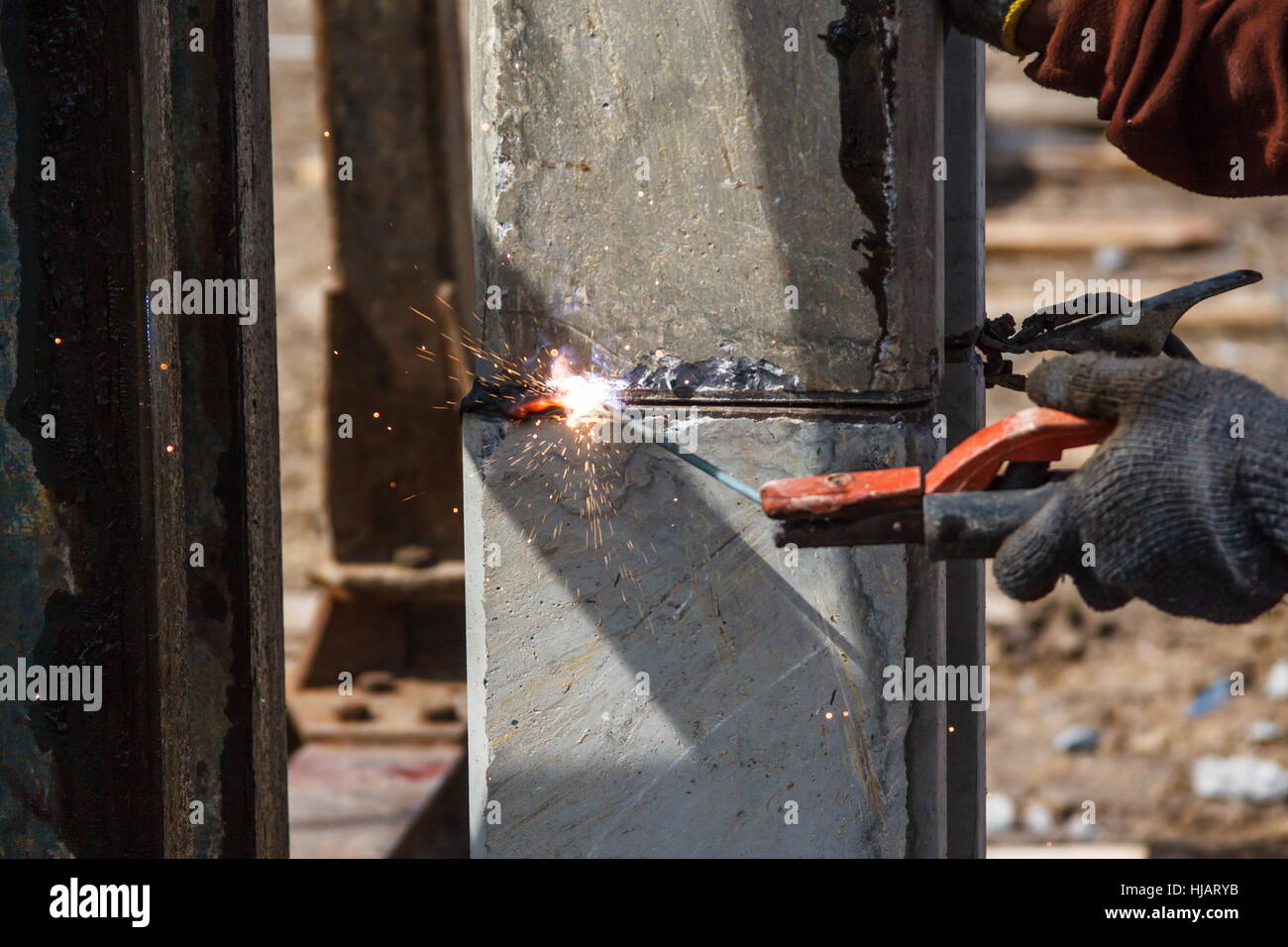 Welding torch working on metal construction Stock Photo - Alamy