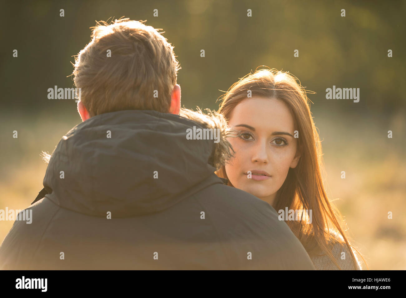 Woman looking over mans shoulder hi-res stock photography and images ...