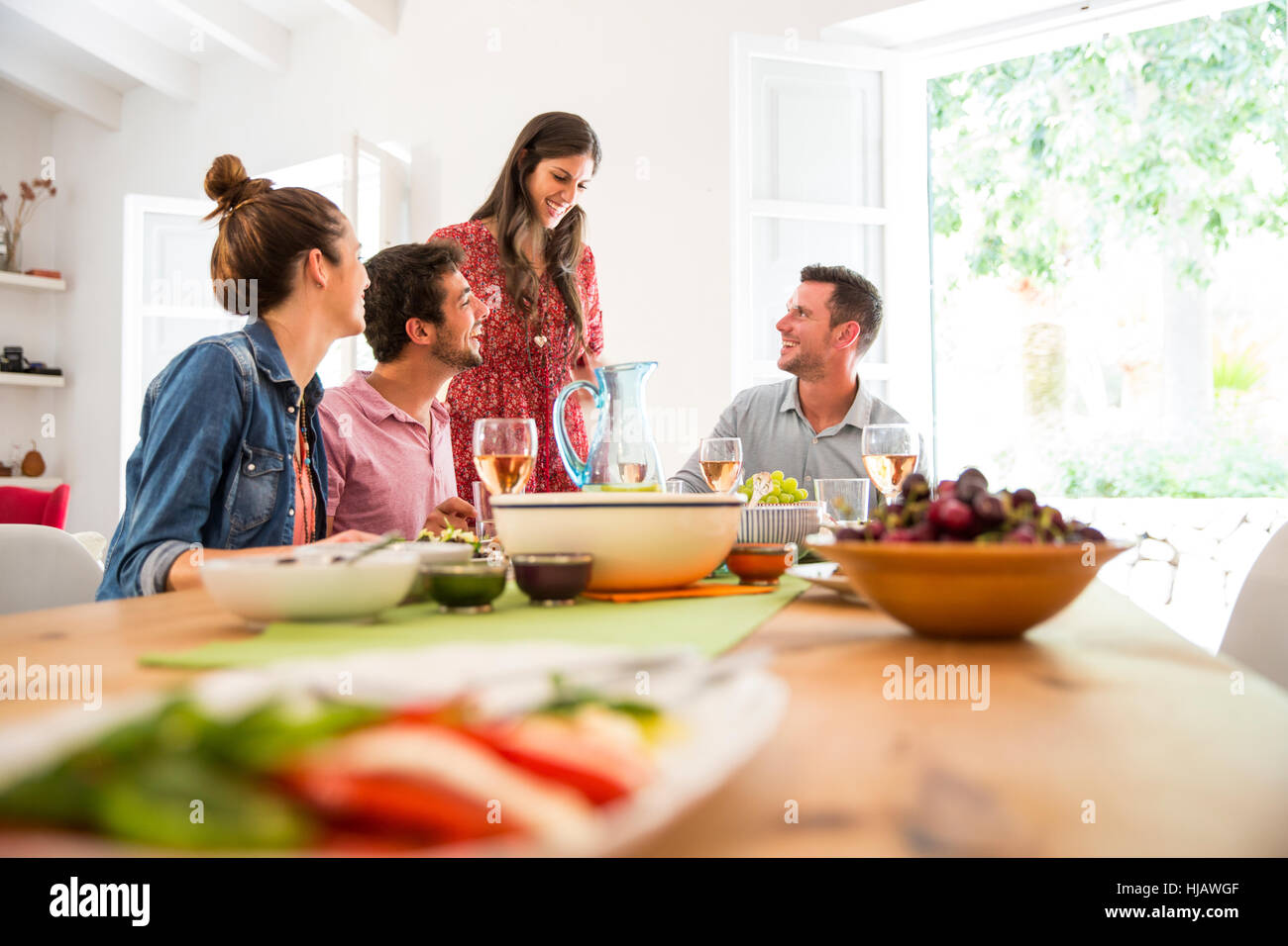 Friends dining together Stock Photo - Alamy