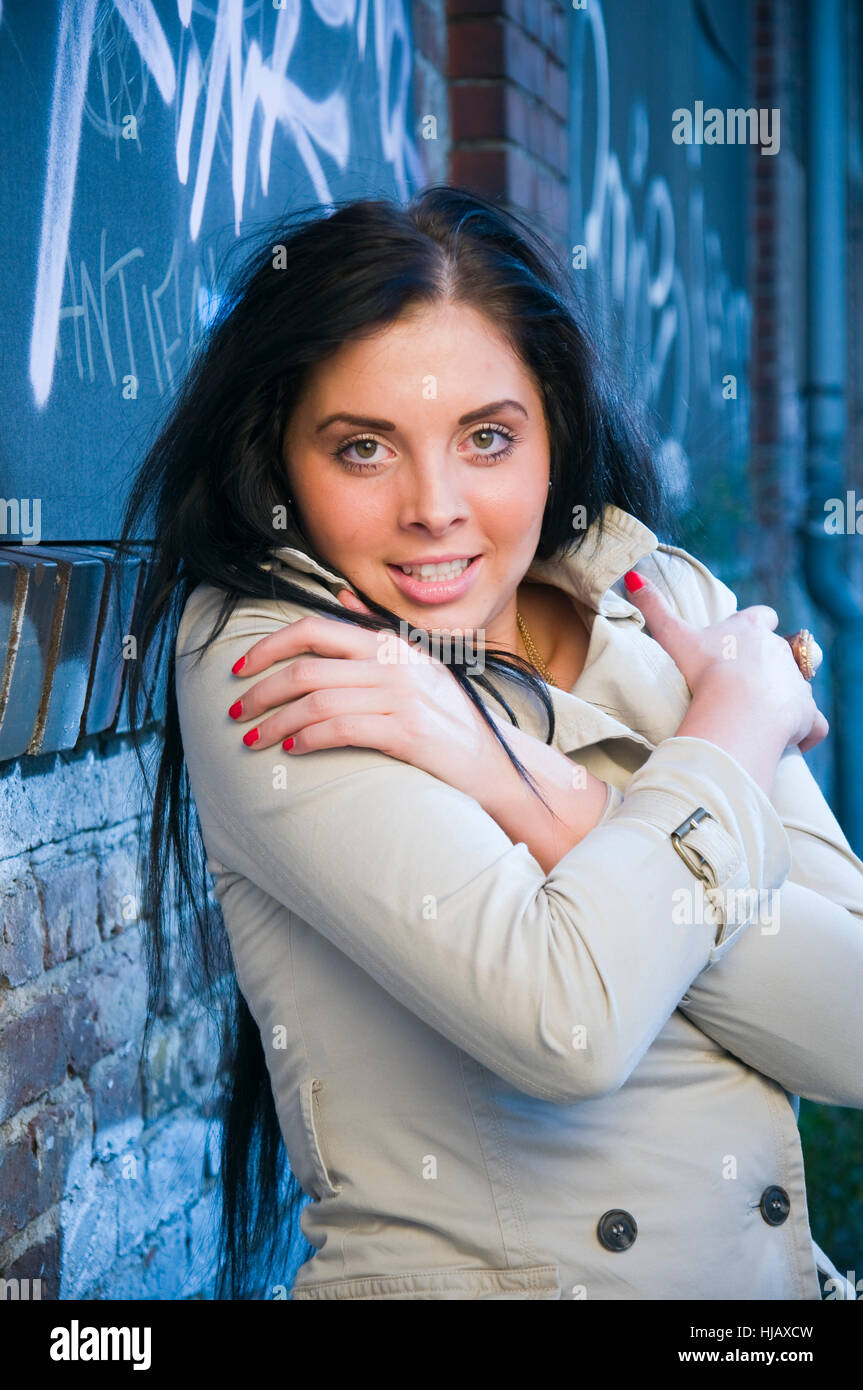 self embrace at the wall Stock Photo - Alamy