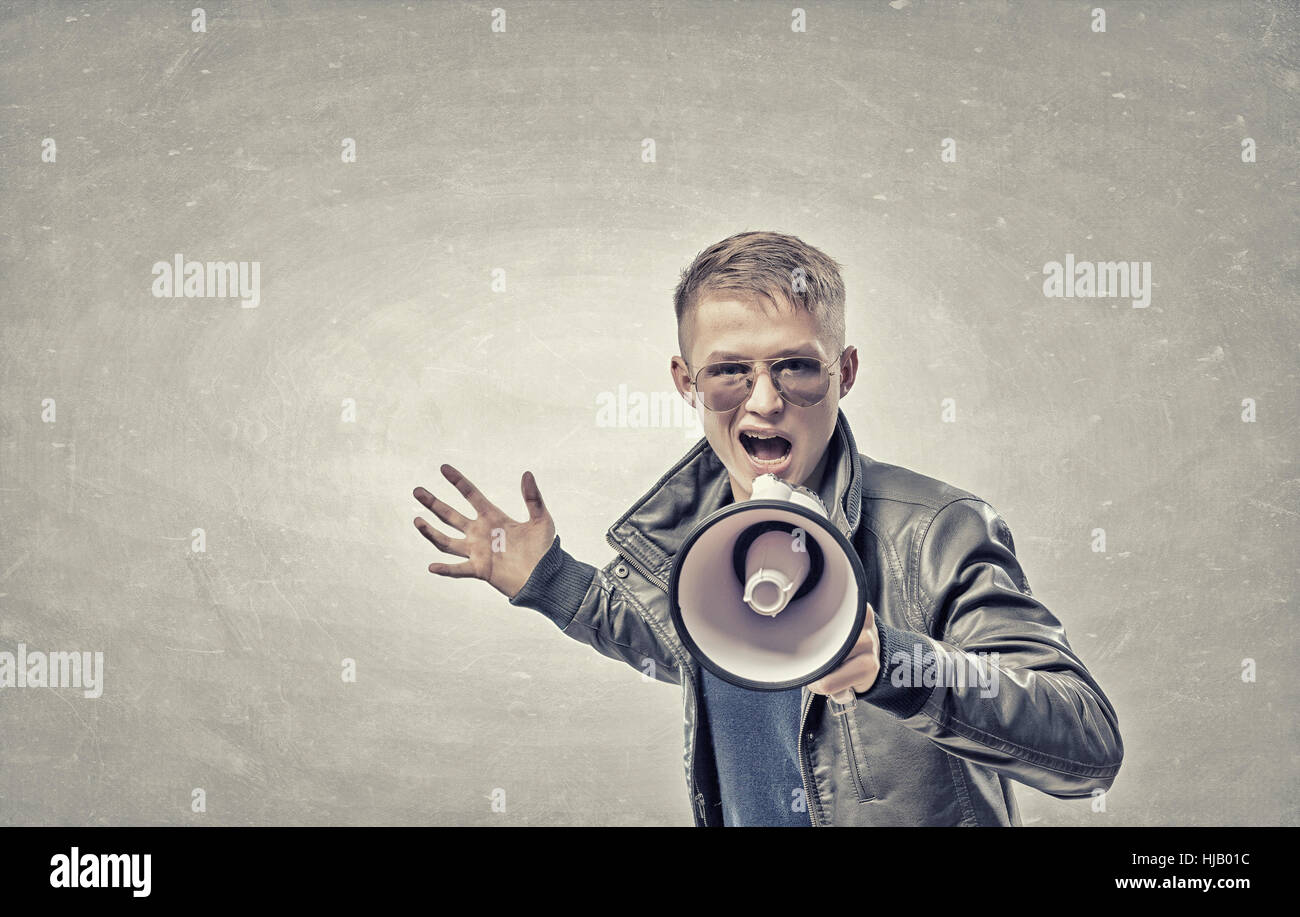 Aggressive guy shouting on megaphone hi-res stock photography and ...