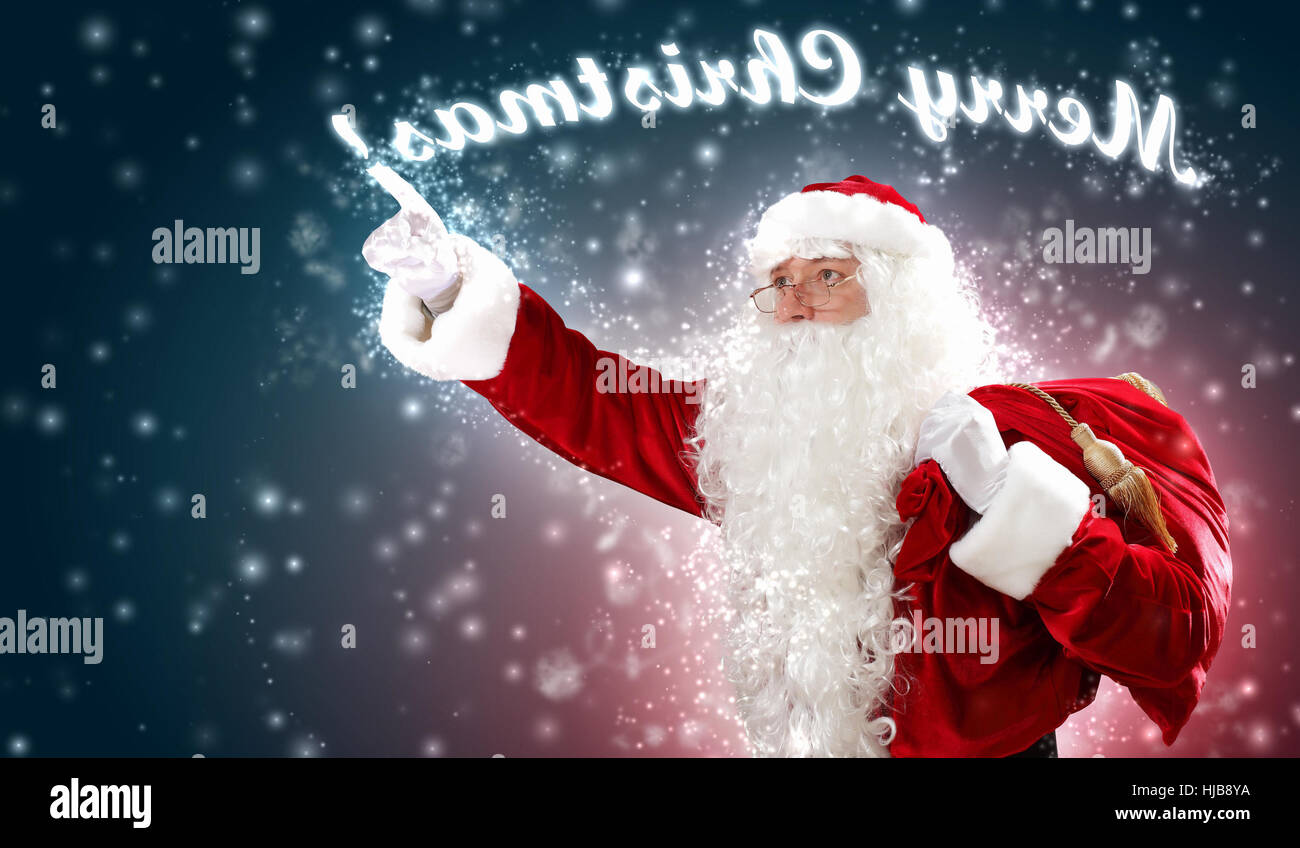 Hands holding santa claus hi-res stock photography and images - Alamy