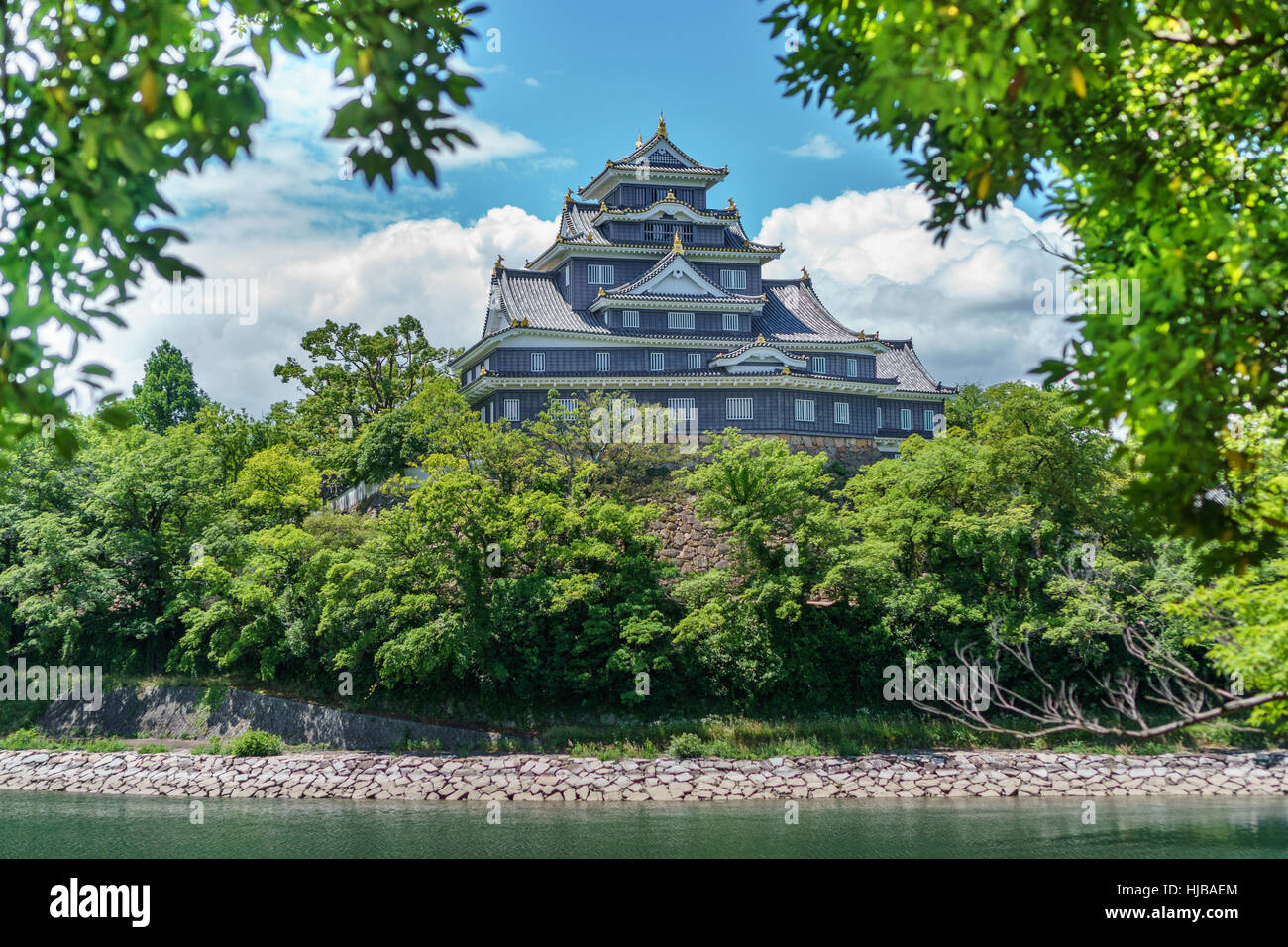 Okayama castle behind trees, Japan Stock Photo - Alamy