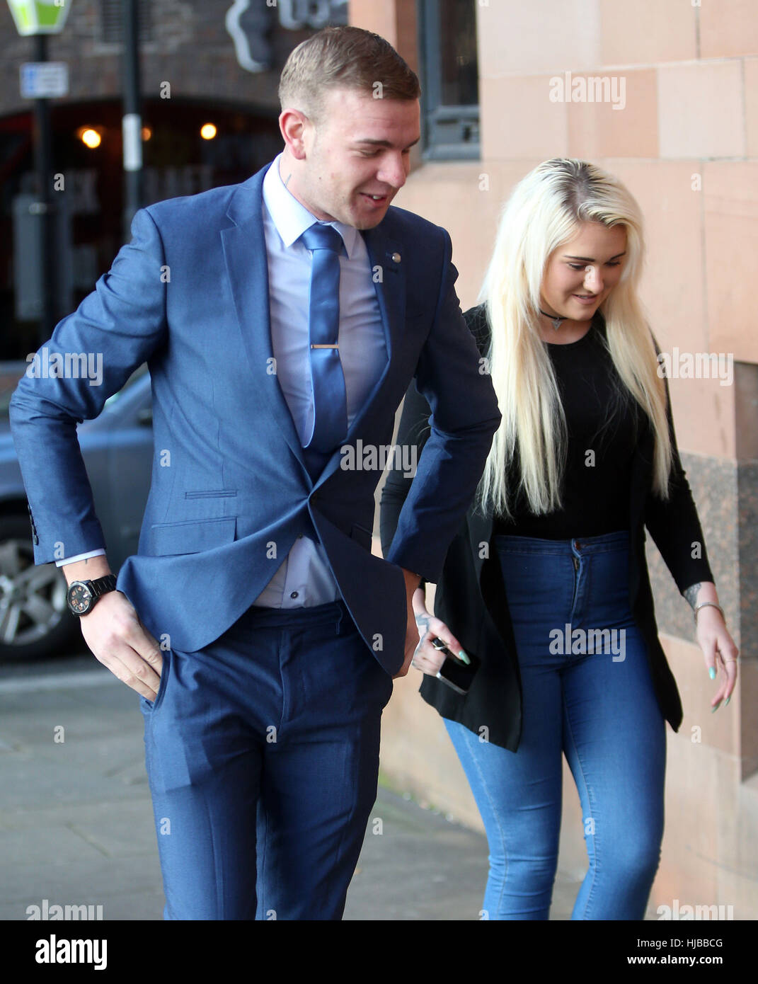 6ft 7in Adam Elliott arrives at Newcastle Crown Court where he denies ...