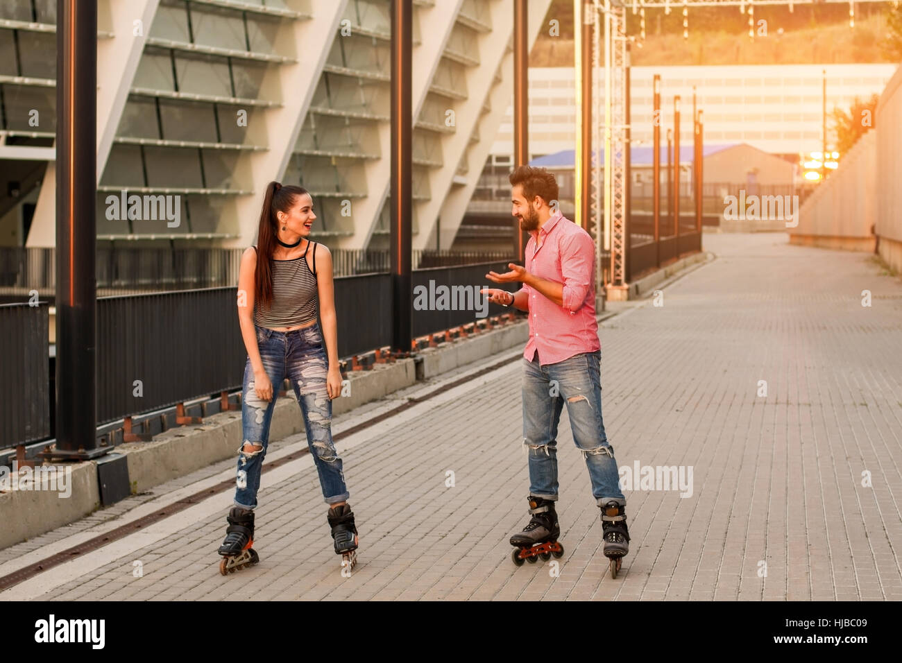 Couple roller skating High Resolution Stock Photography and Images - Alamy