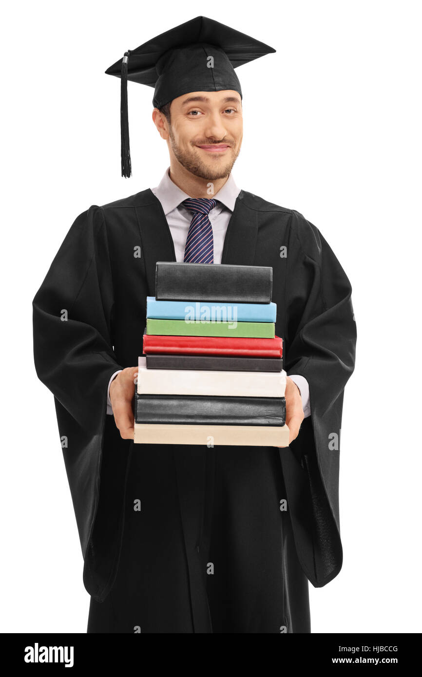 Male graduate student holding a stack of books isolated on white ...