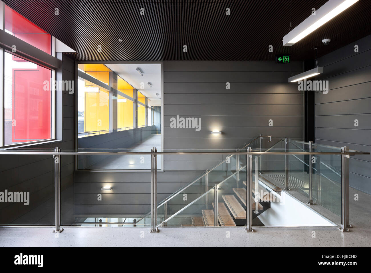 Stairs leading up to reception area featuring coloured panels from ...