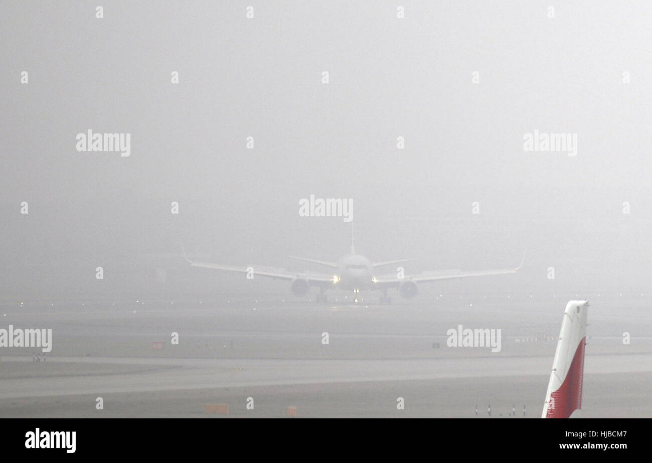 A plane on the tarmac at Heathrow Airport, London, as dense fog caused ...