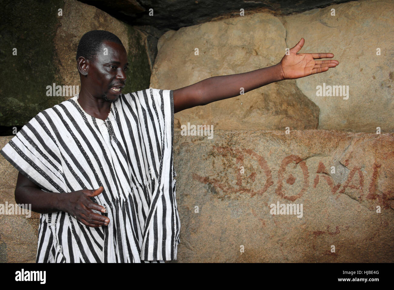 Ghanaian Guide In Cave At Talensi Tribal Village - Tengzug, Ghana Stock ...