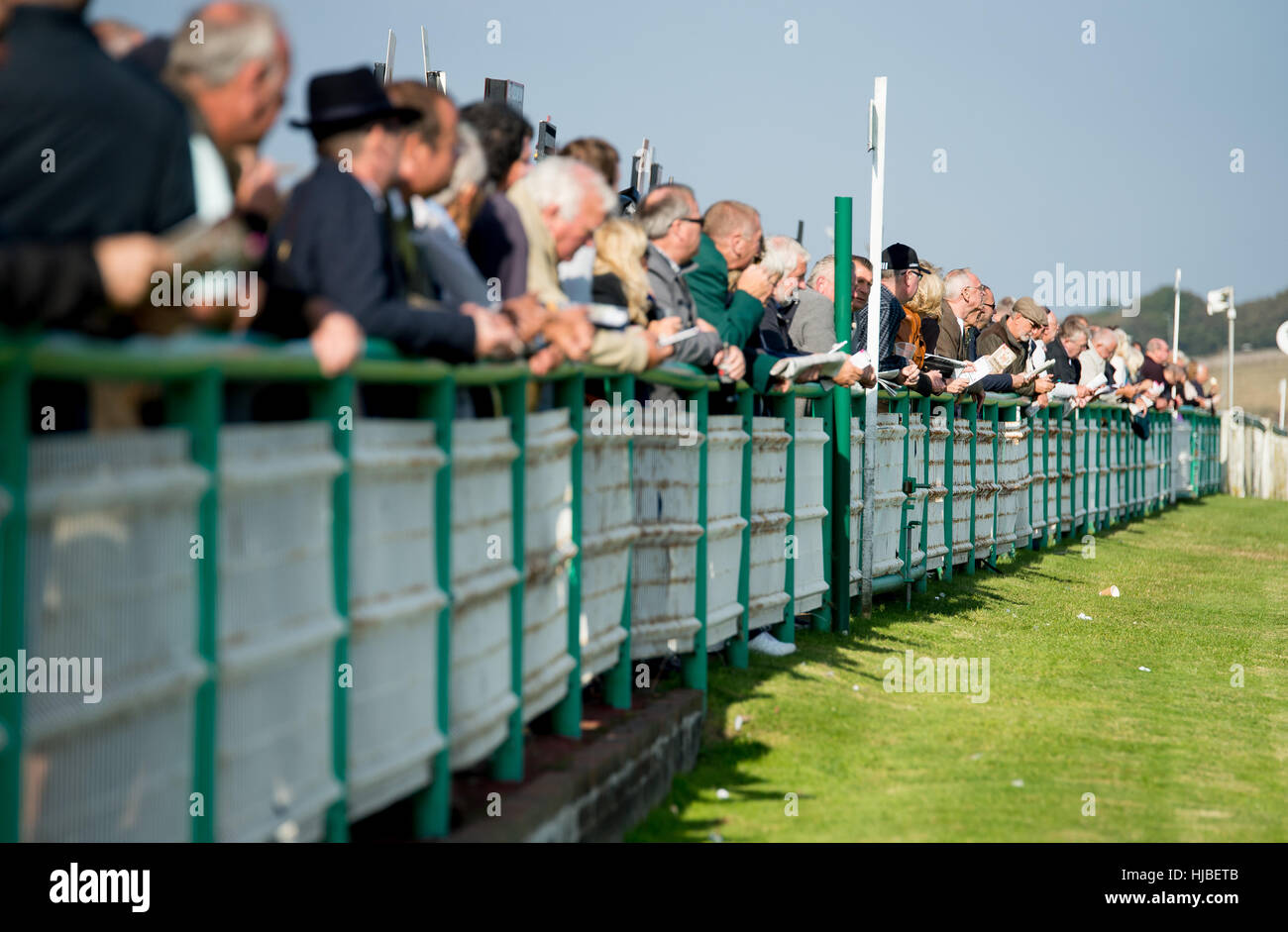 Crowds gather at the fence awaiting to see the horses race at Brighton ...